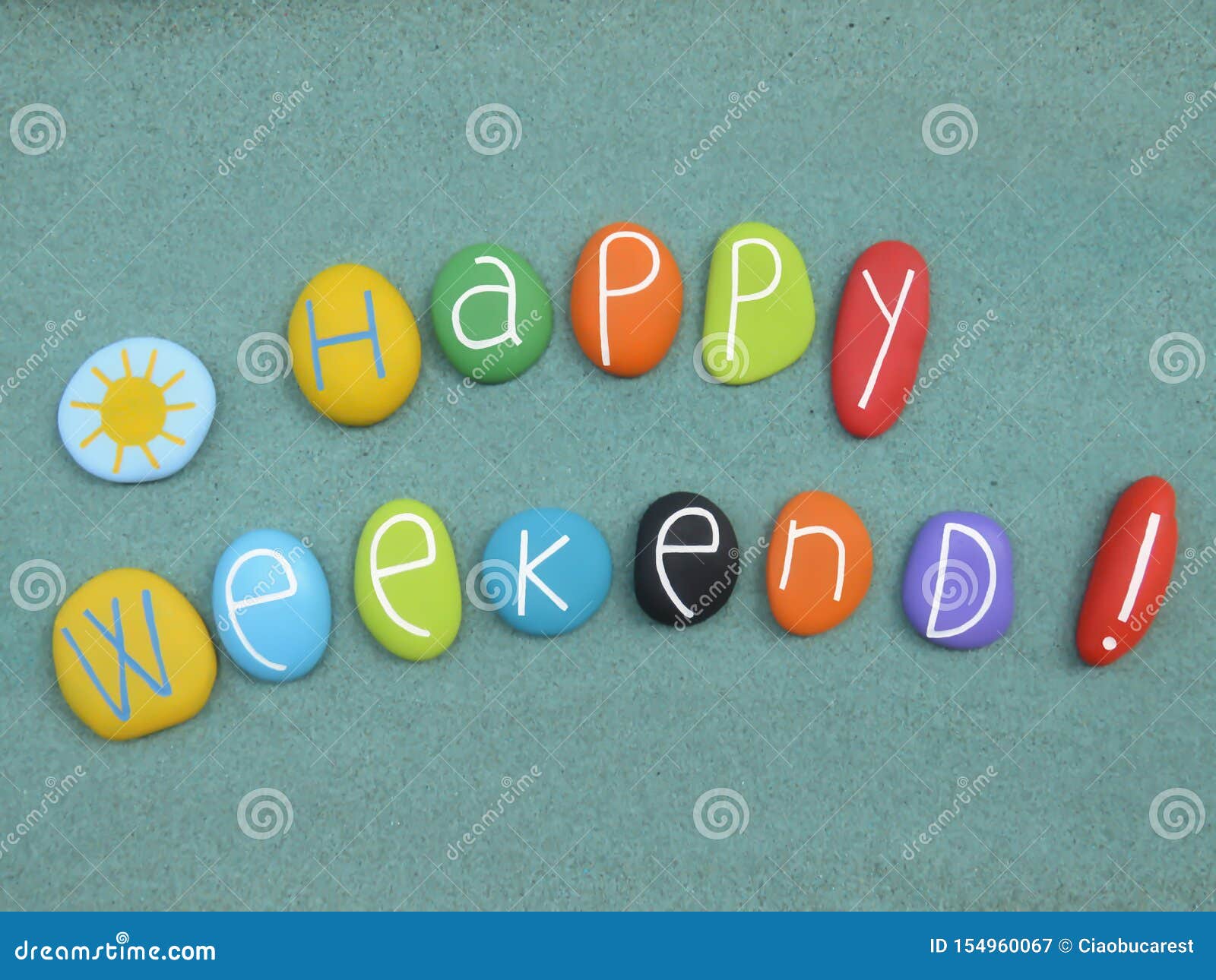 Happy Weekend Text Composed with Multi Colored Stones Over Green Sand ...