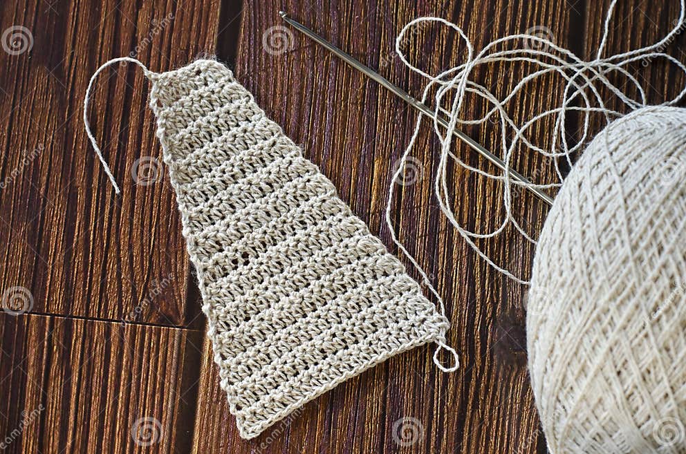 Handmade Crocheted with White Linen Threads on a Wooden Table Stock ...