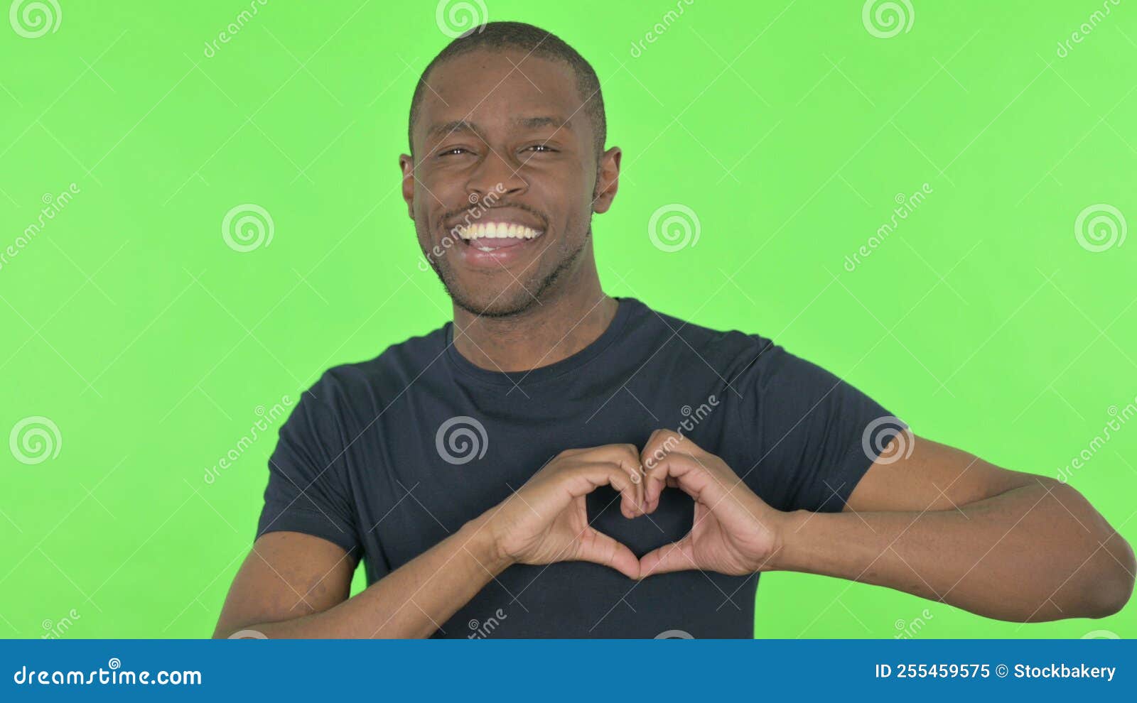 Handmade Heart by Young African Man on Green Background Stock Image ...