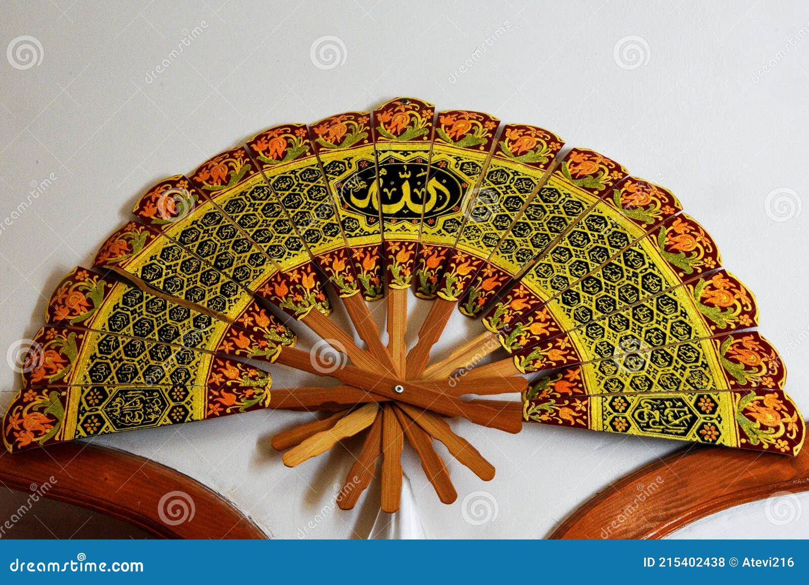 A Handmade, Large Multi-colored Fan is Fixed on the Wall. Stock Photo ...