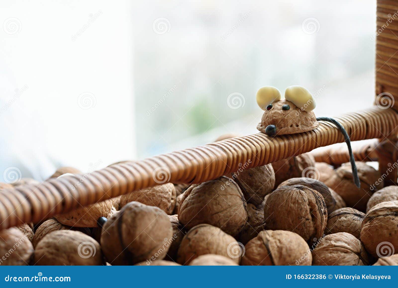 Handmade Mouse Made from Walnut Shell on the Handle of a Basket with ...