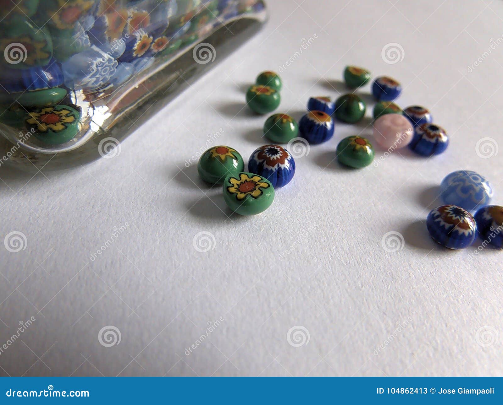 Handmade Multi-colored Glass Beads on White Surface with Soft Light ...