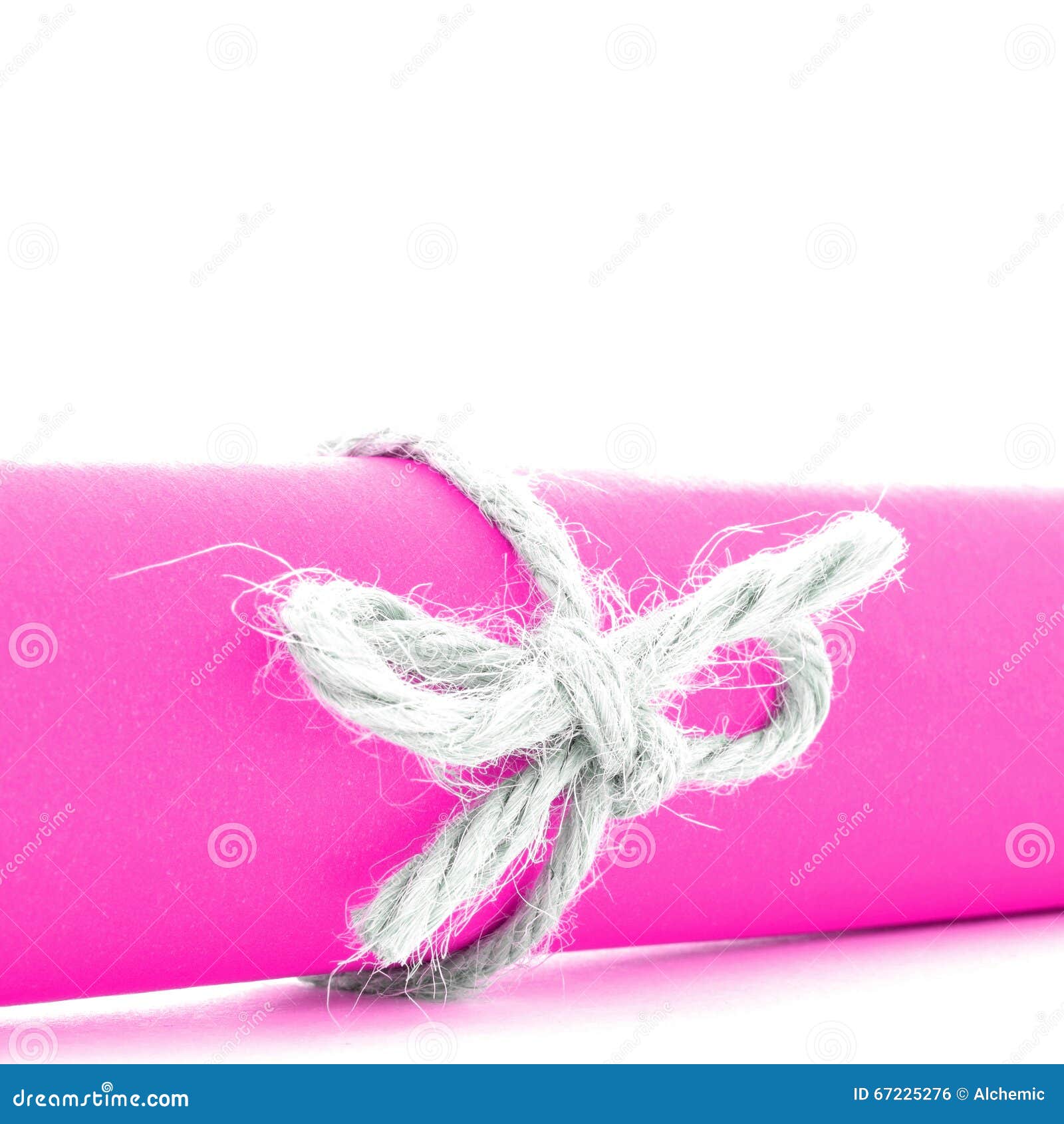 Handmade Natural String Knot Tied on Pink Paper Roll Isolated Stock ...