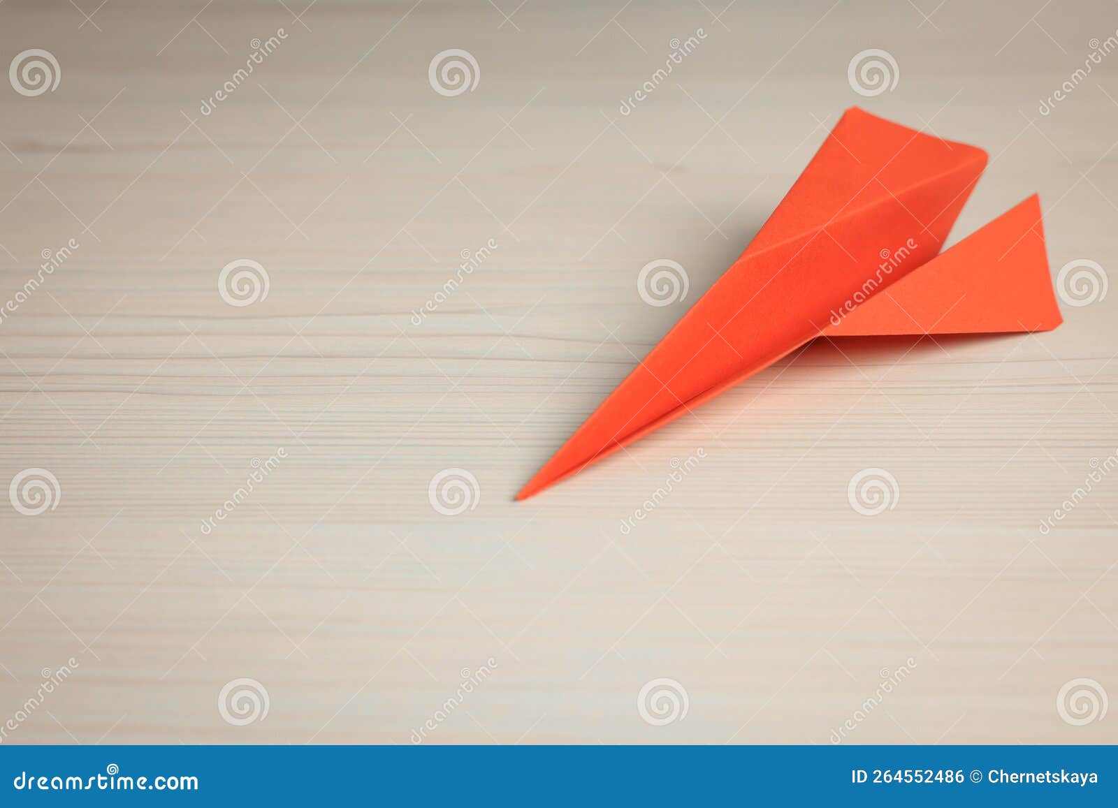 Handmade Orange Paper Plane on Beige Wooden Table. Space for Text Stock ...