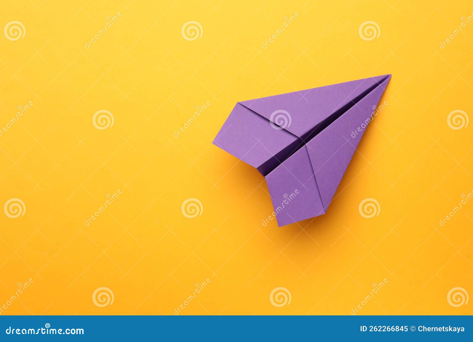 Handmade Purple Paper Plane on Yellow Background, Top View. Space for ...