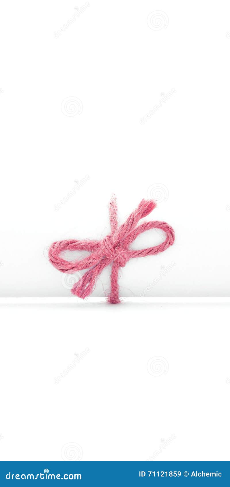 Handmade Red String Bow Tied on White Paper Package Stock Image - Image ...