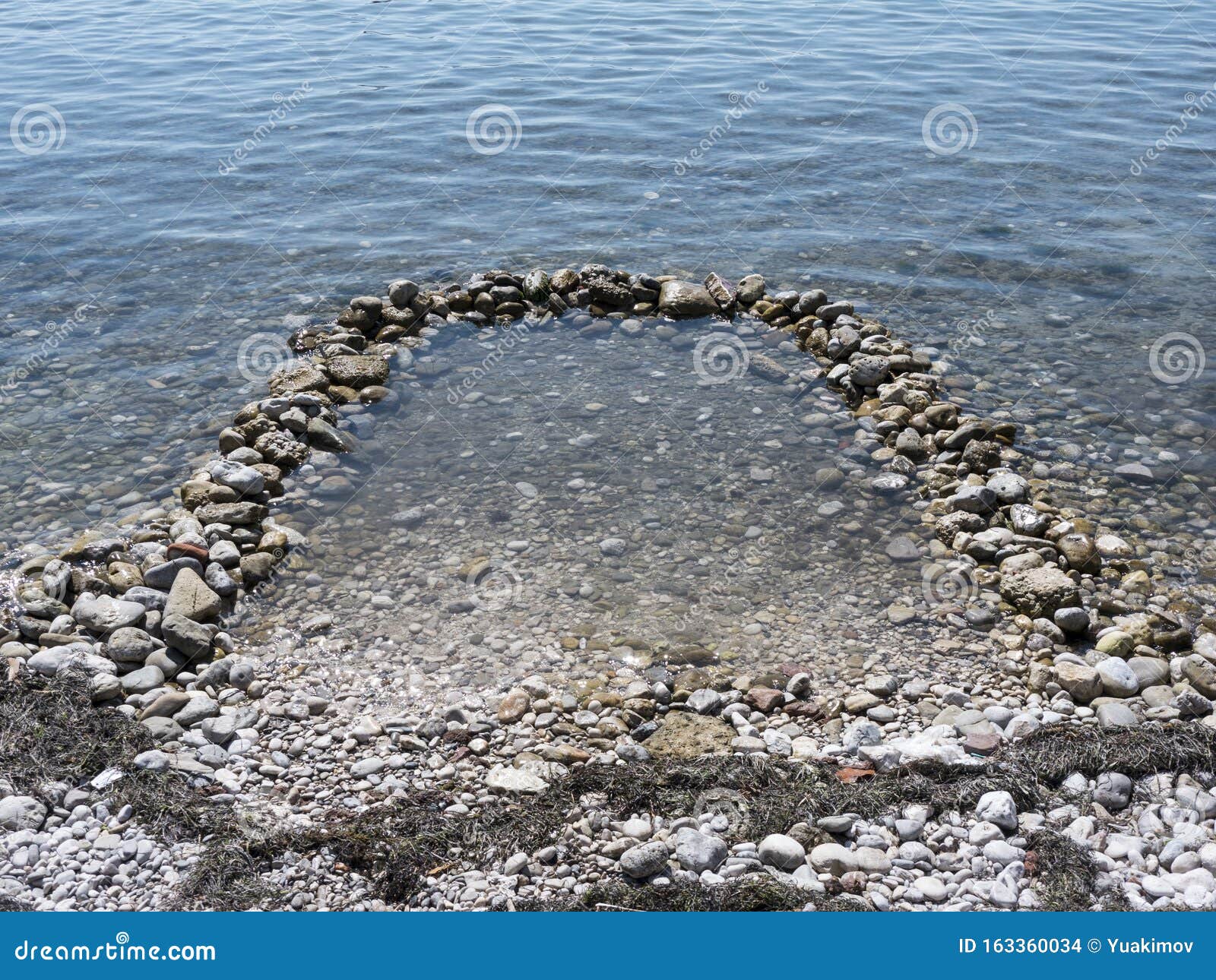 Handmade Stone Pool for Kids with Eater on Seaside Stock Photo - Image ...