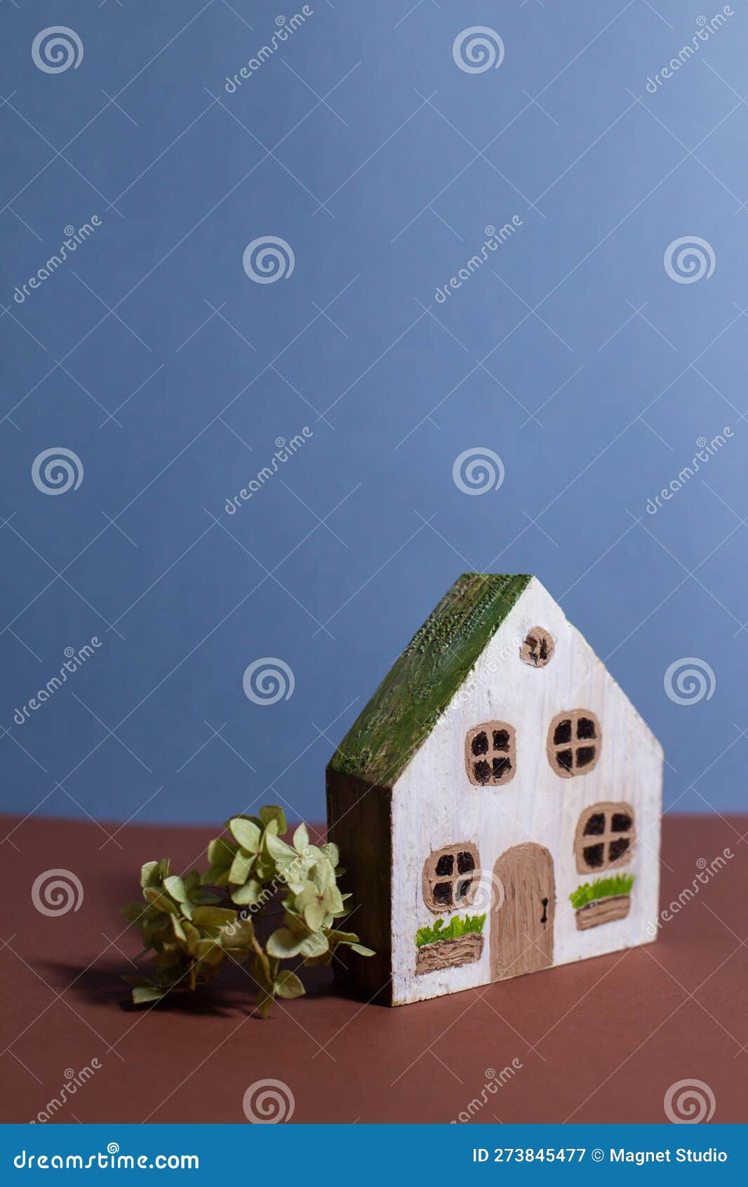 A Handmade Wooden House Painted with Paints on a Plain Background Stock ...