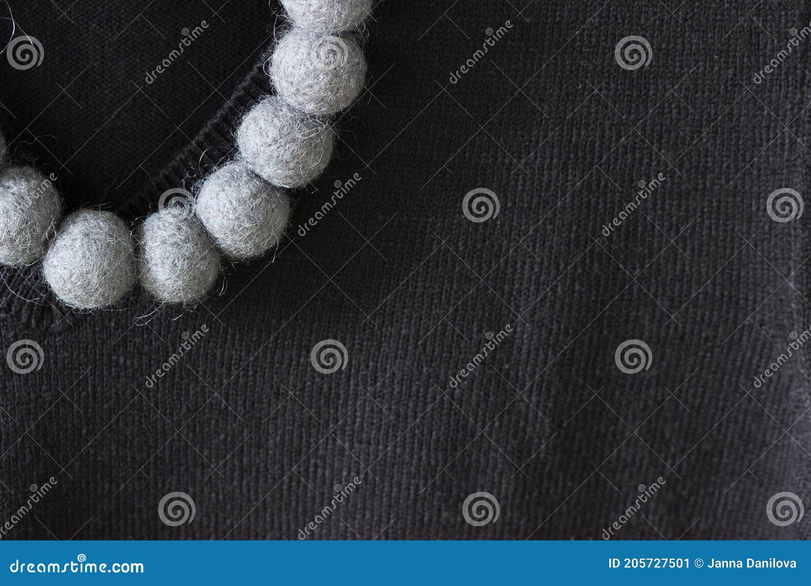 Handmade Wool Necklace on the Background of Clothes. Stock Image ...