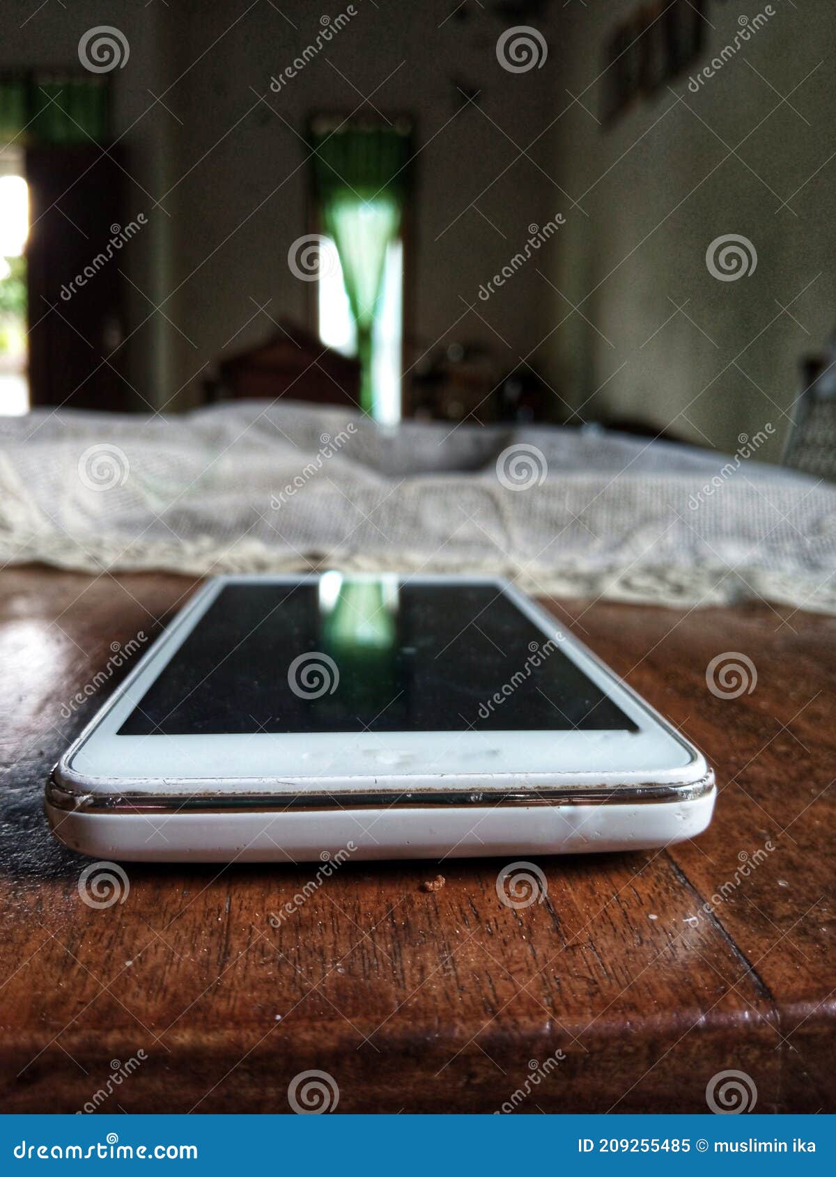 Handphone on the table stock image. Image of brown, white - 209255485