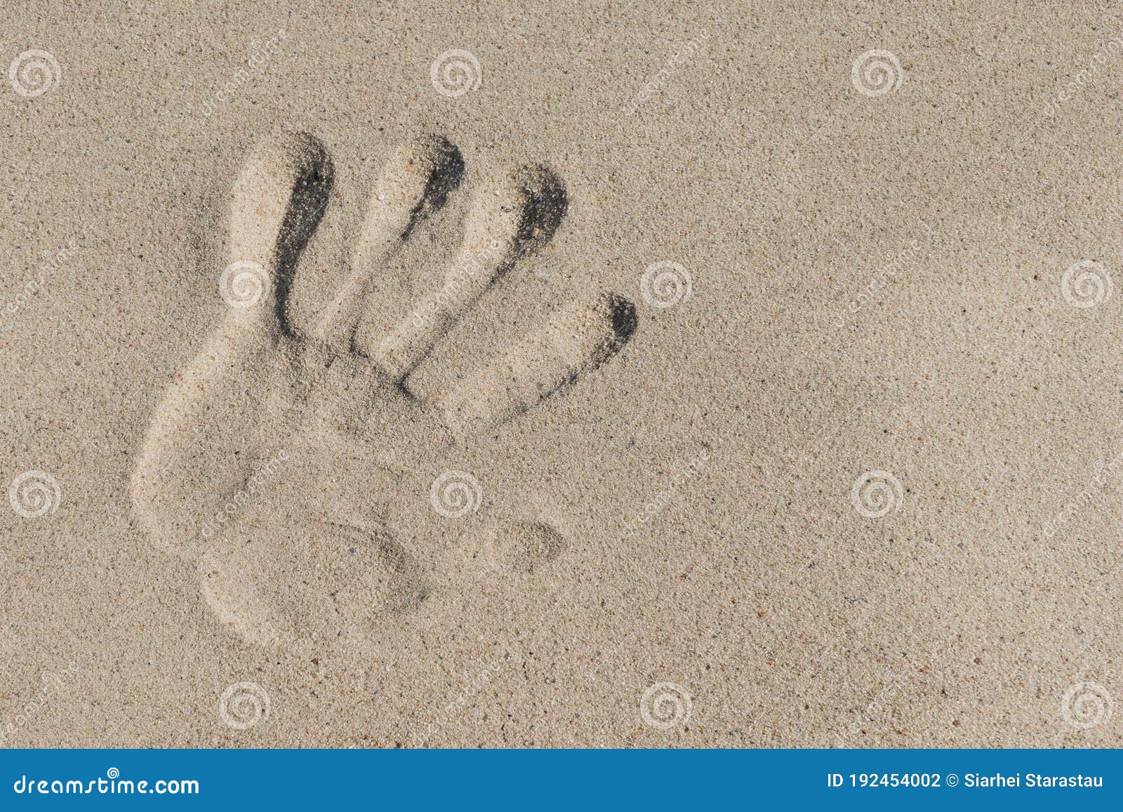 Handprint on river sand stock photo. Image of family - 192454002