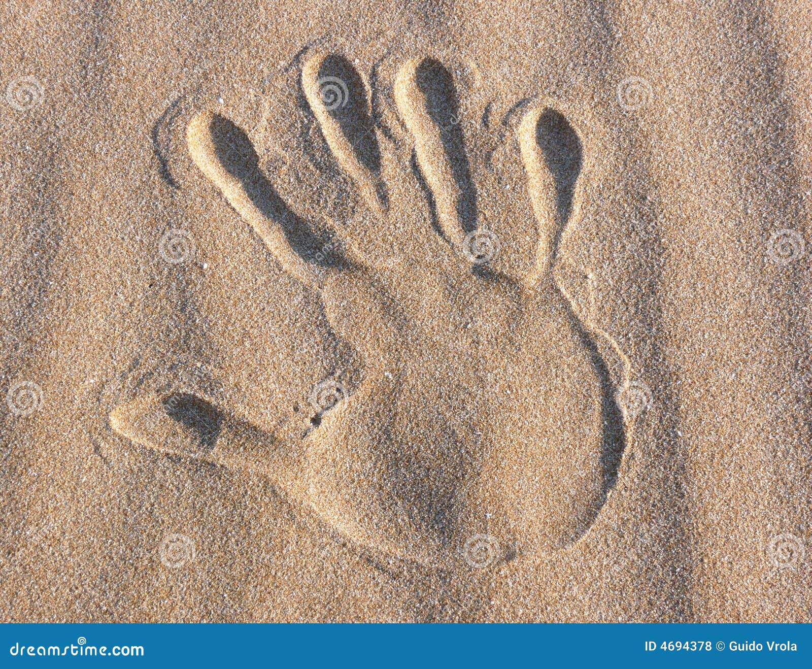 Handprint in the sand stock photo. Image of sand, serenity - 4694378