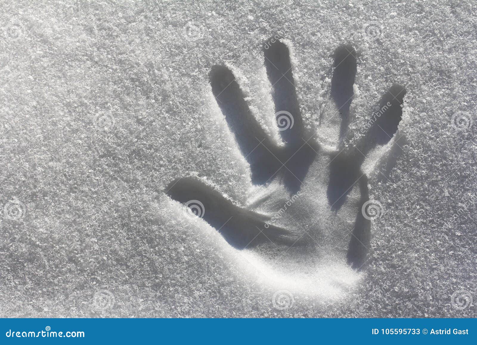 A handprint in the snow stock image. Image of shadow - 105595733