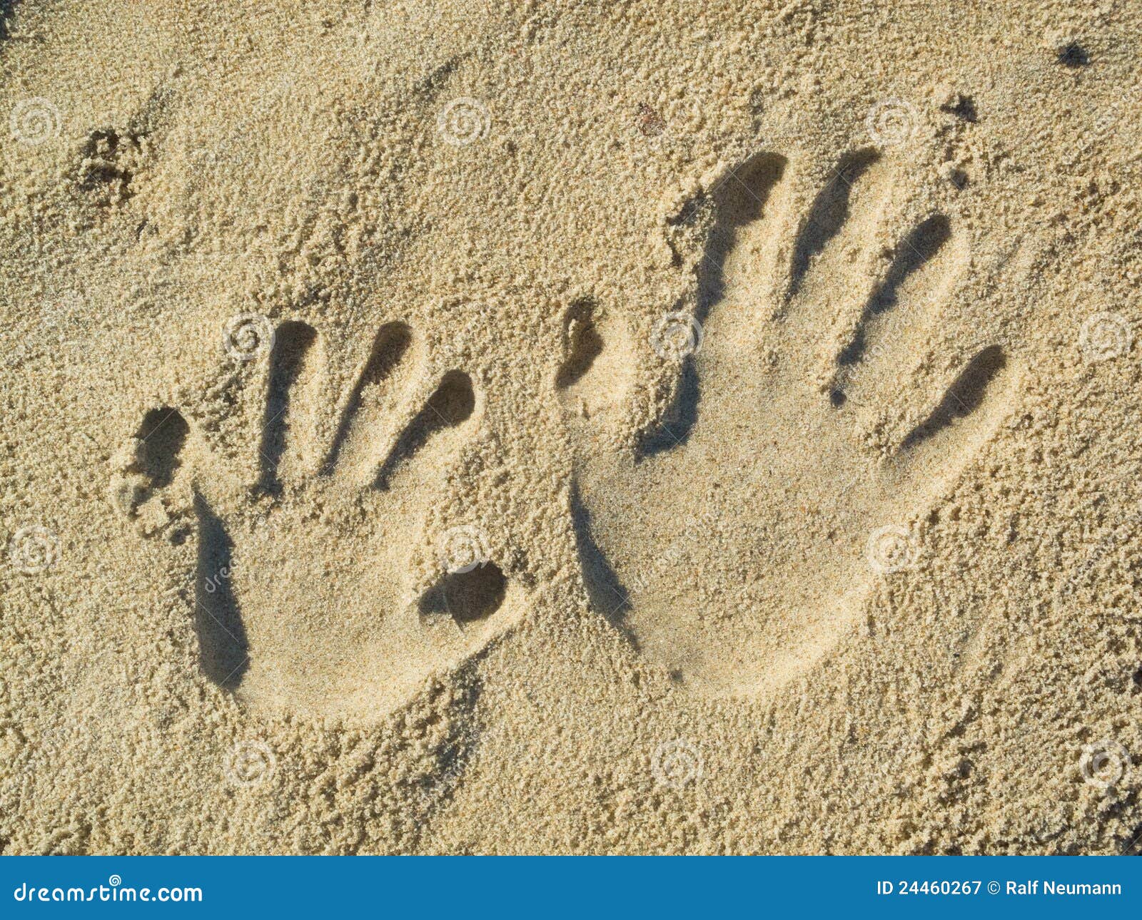 Handprints in the sand stock image. Image of print, finger - 24460267