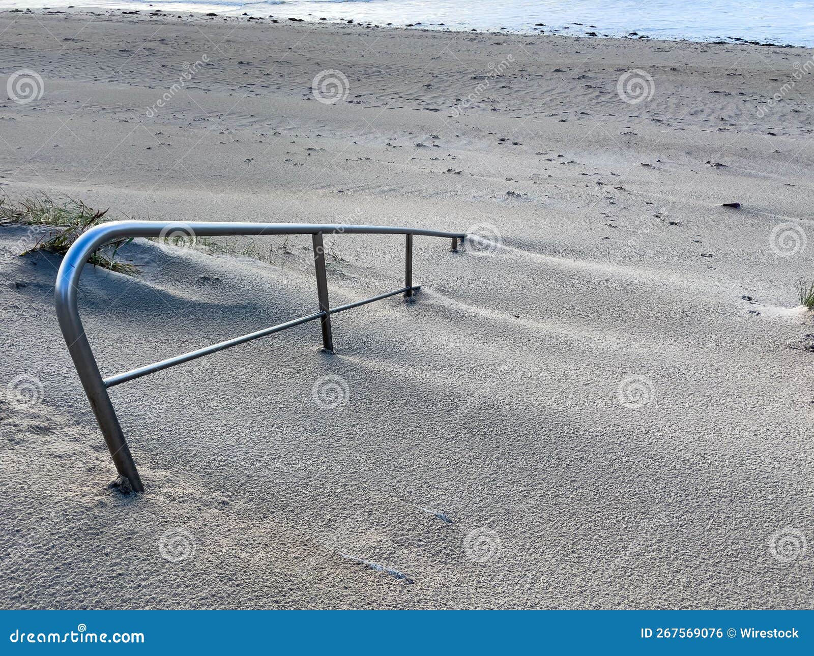 Handrail covered by sand stock photo. Image of outdoor - 267569076