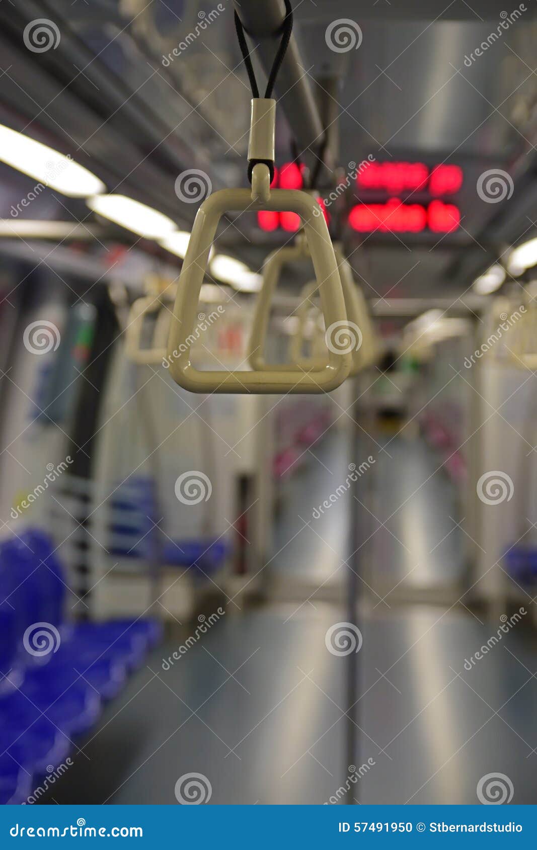 A Handrail in Focus Inside a Train Designed To Be Grasped by Standing ...