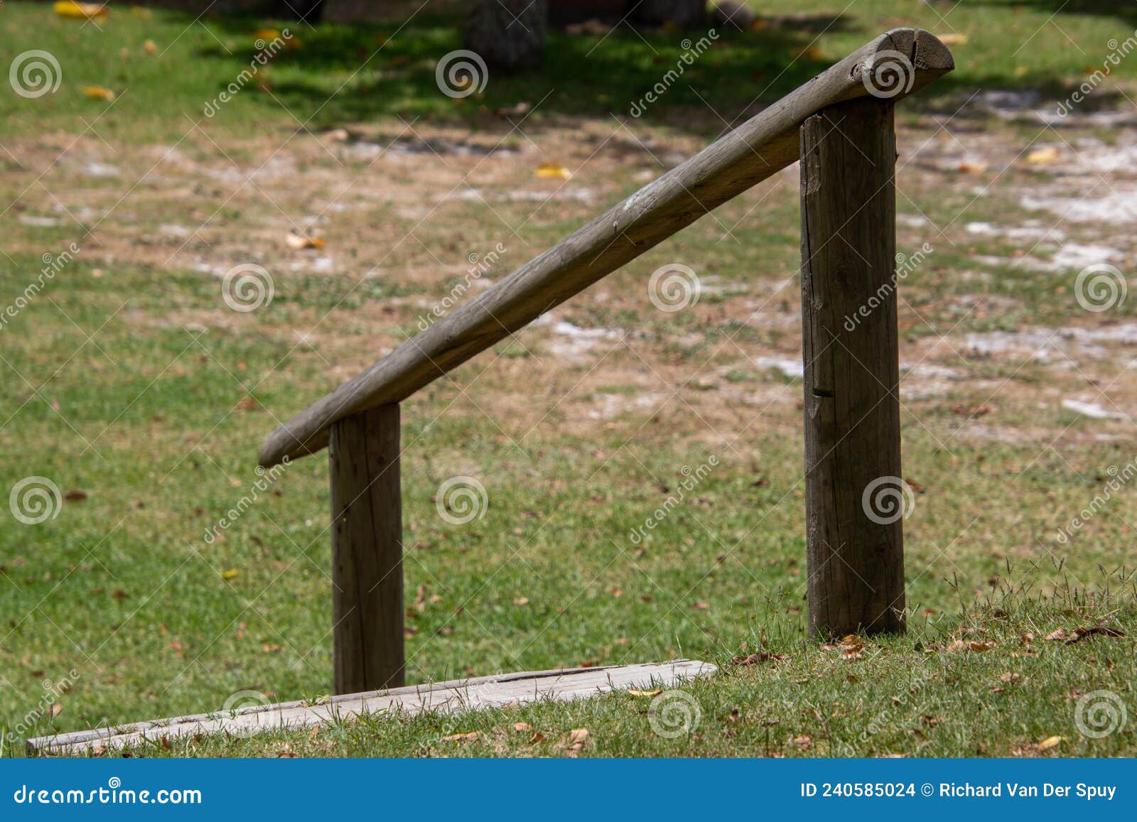 Wooden handrail in a park stock photo. Image of space - 240585024