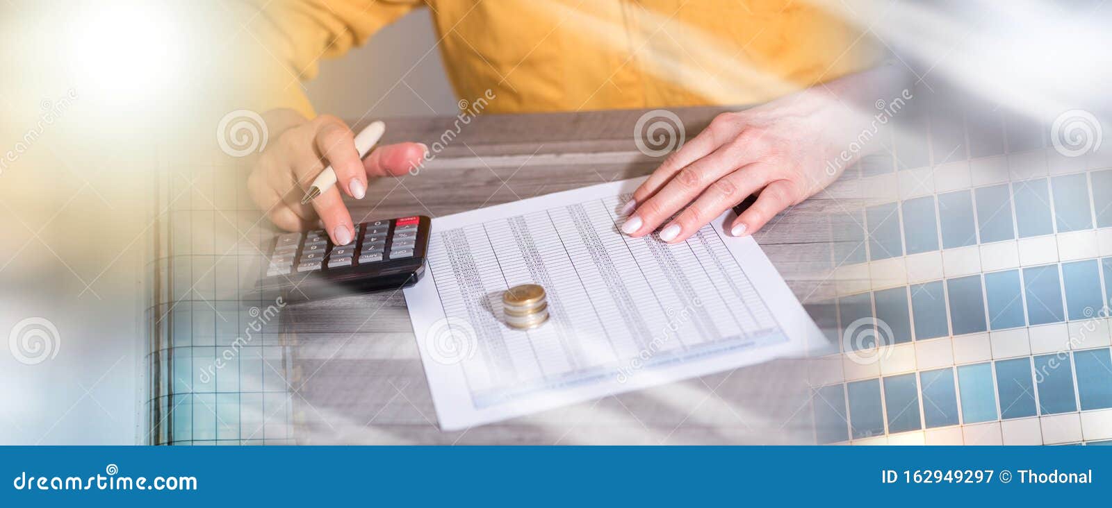 Hands of an Accountant Working on Financial Documents; Multiple ...
