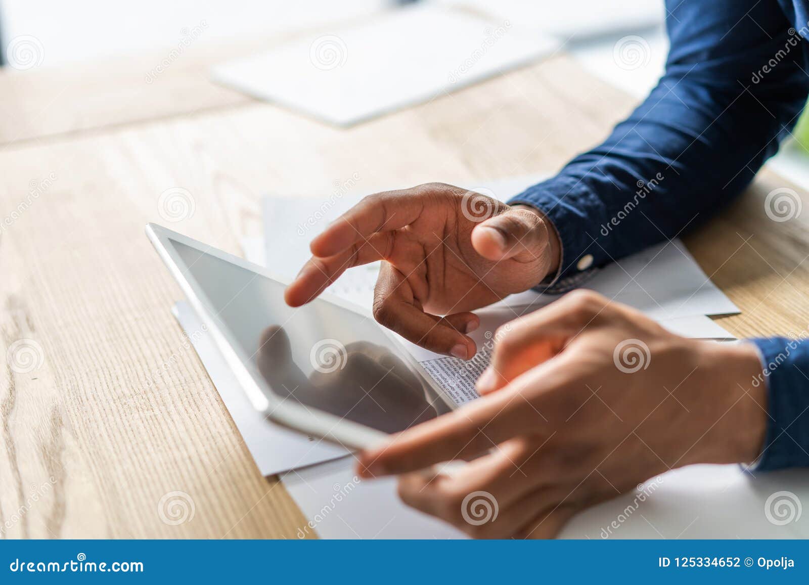 Hands of an African Businessman Using Digital Tablet in Office. Stock ...