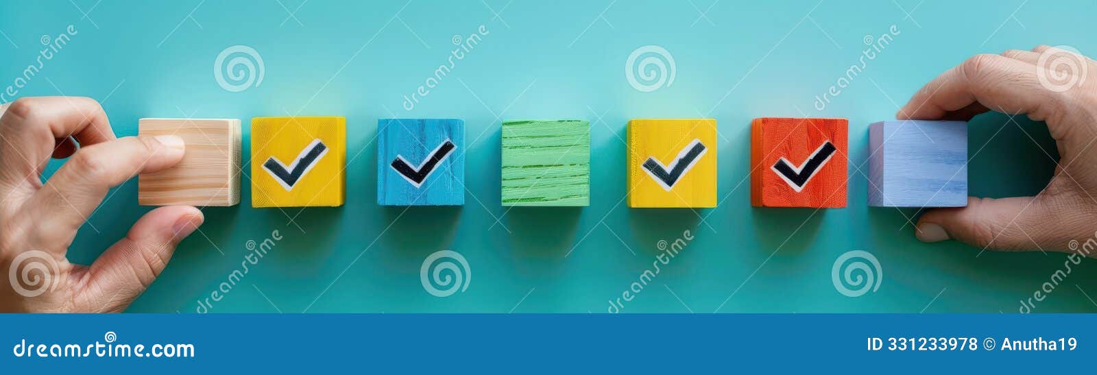 Hands Arranging Colorful Blocks with Check Marks on a Teal Background ...