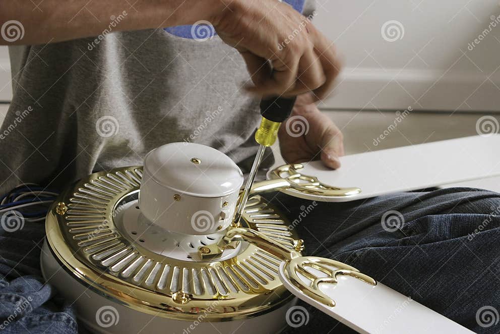 Hands Assembling a Ceiling Fan Stock Photo - Image of construction ...