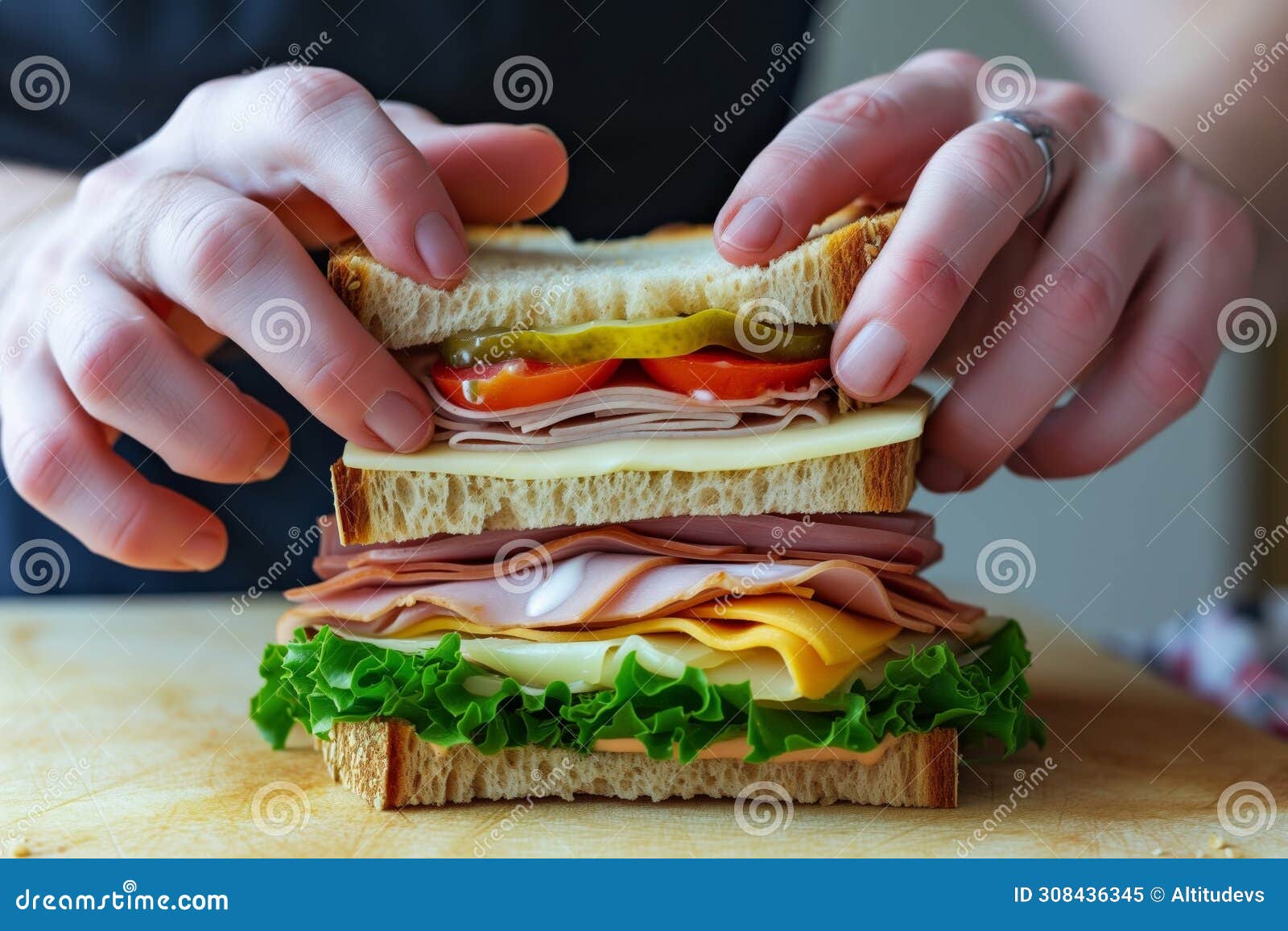 Hands Assembling a Sandwich with Layers Visible Stock Image - Image of ...