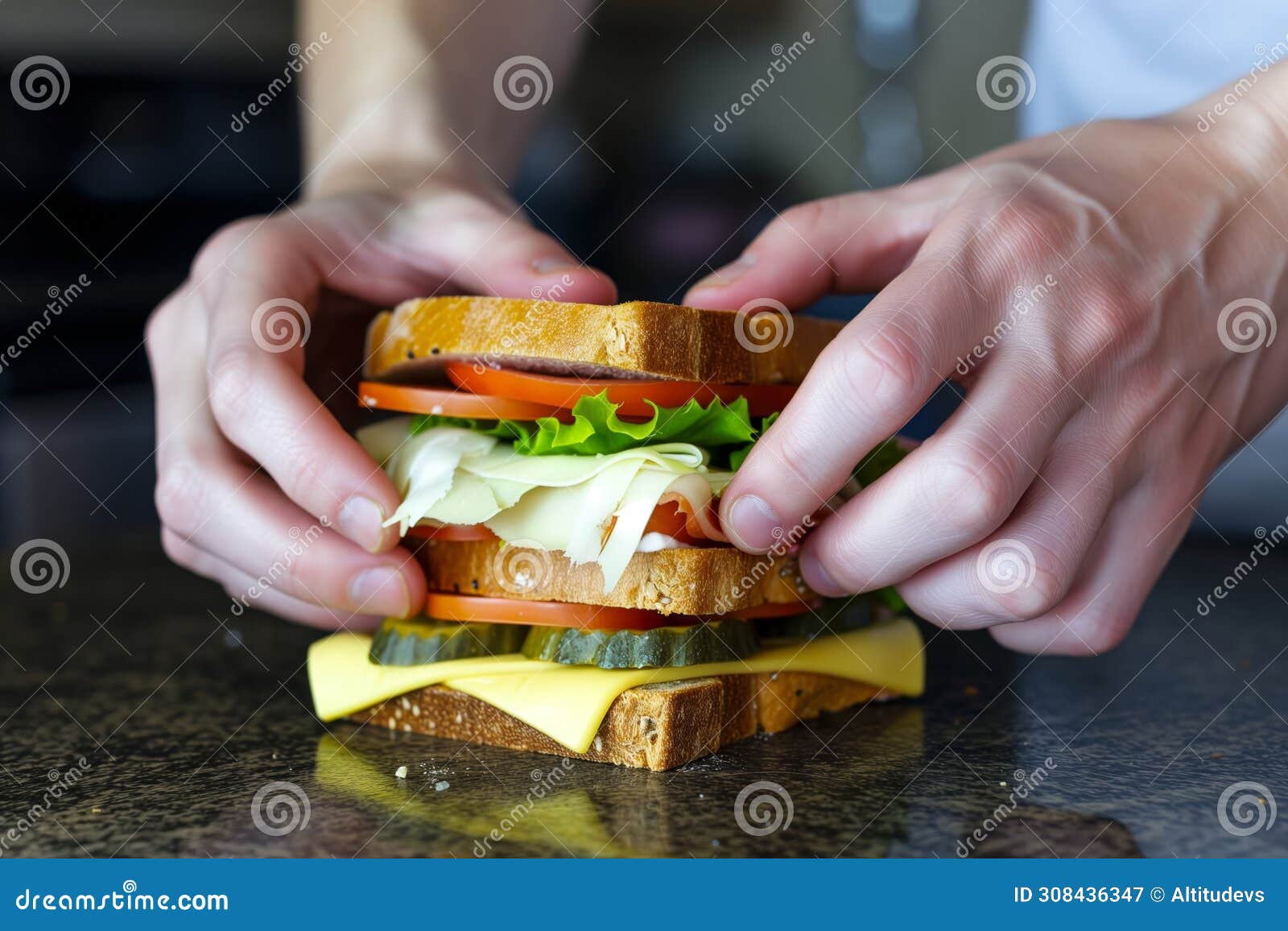 Hands Assembling a Sandwich with Layers Visible Stock Image - Image of ...