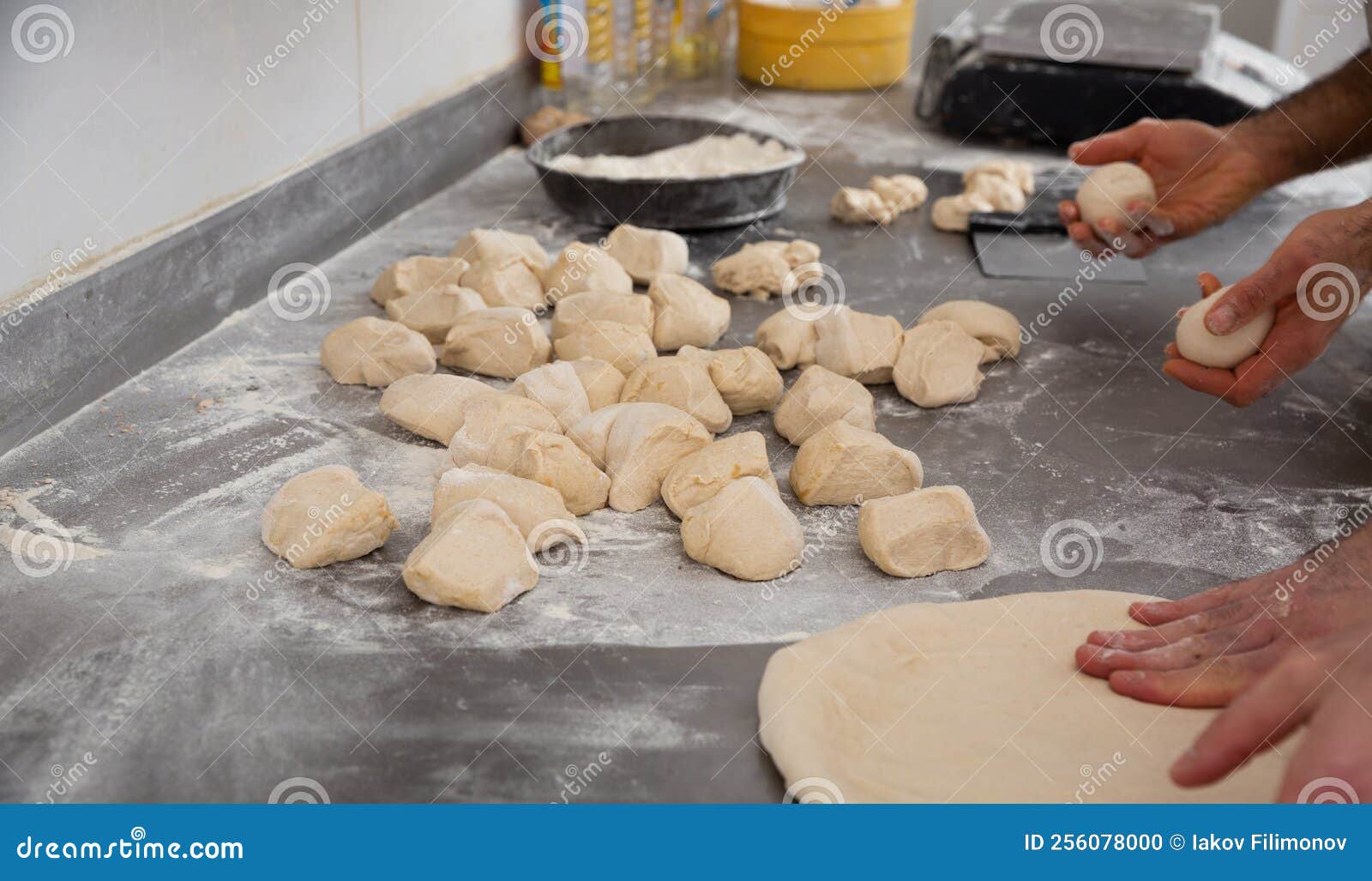 Baker shaping dough stock photo. Image of flatbread - 256078000