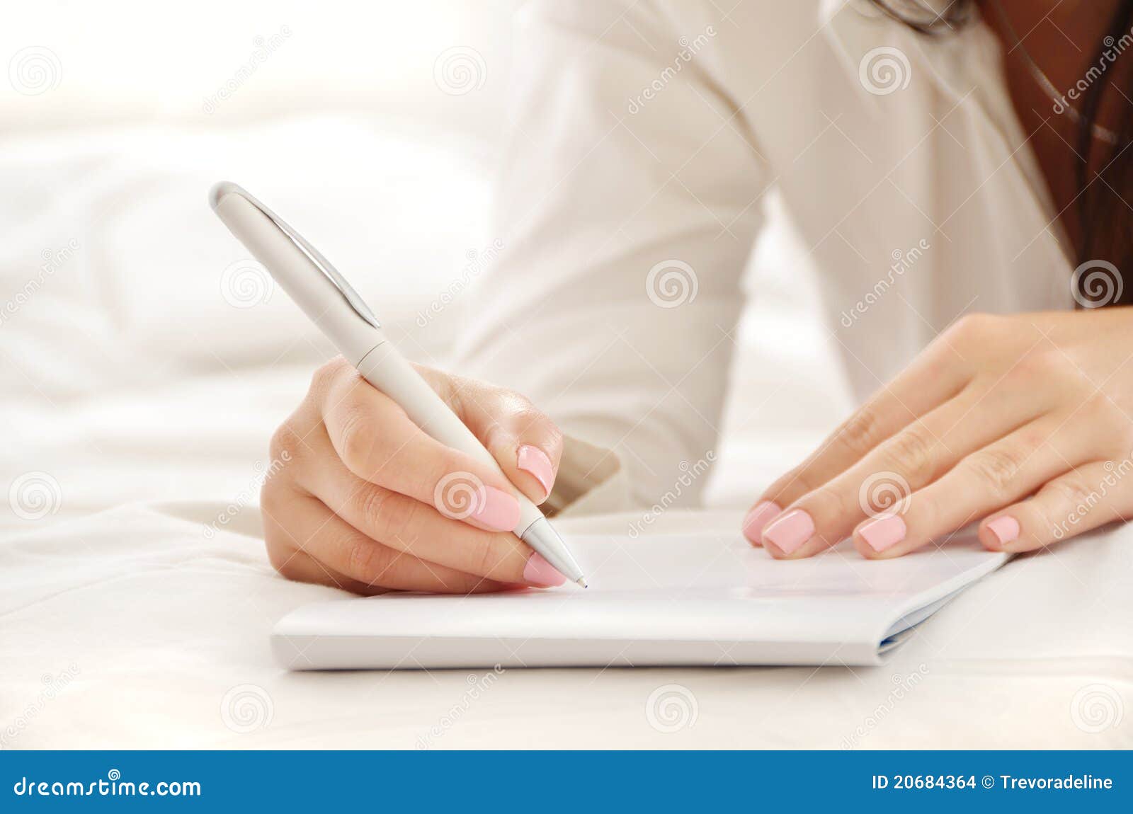 Hands of a Beautiful Young Woman Writing on a Pad Stock Photo - Image ...