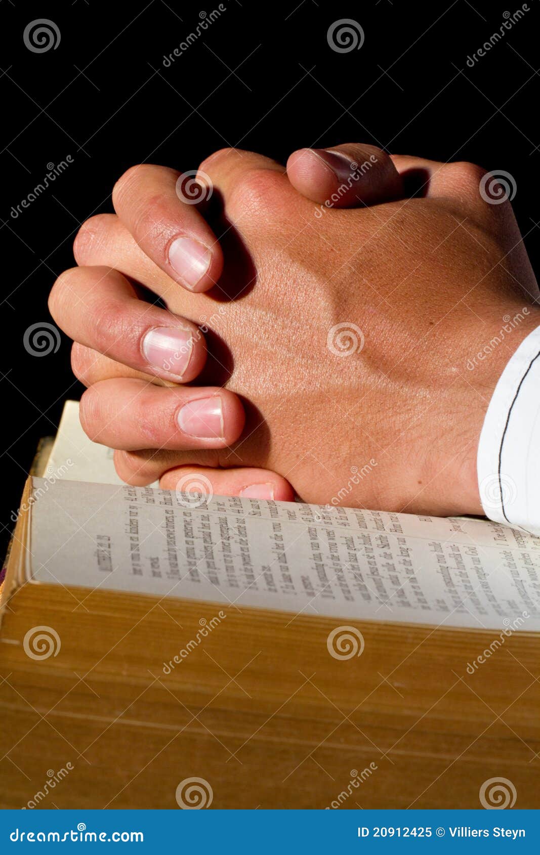 Hands on Bible stock image. Image of pastor, light, faith - 20912425
