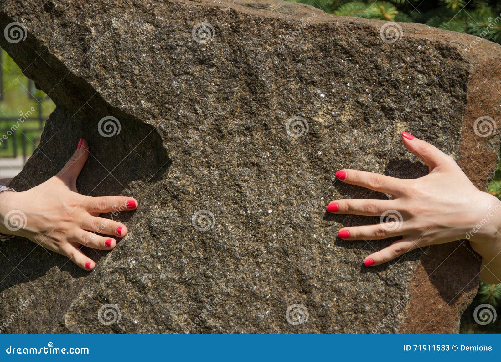 Hands on the big rock stock image. Image of motion, bracelet - 71911583