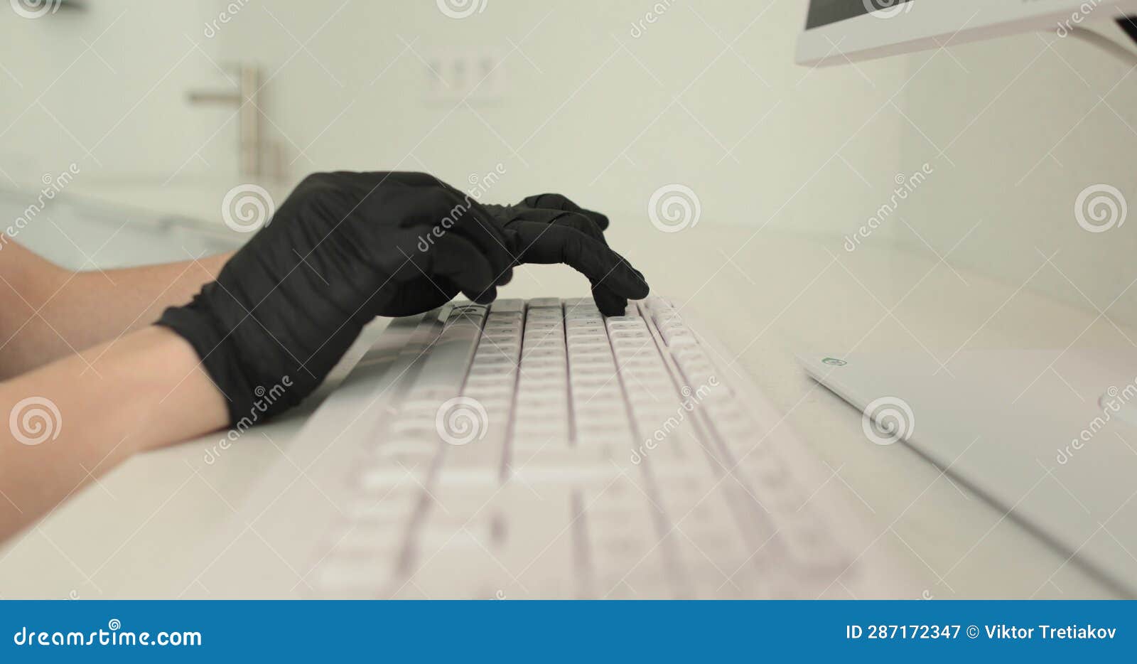 Hands in Black Nitrile Gloves Using Keyboard while Doing Work in Clinic ...
