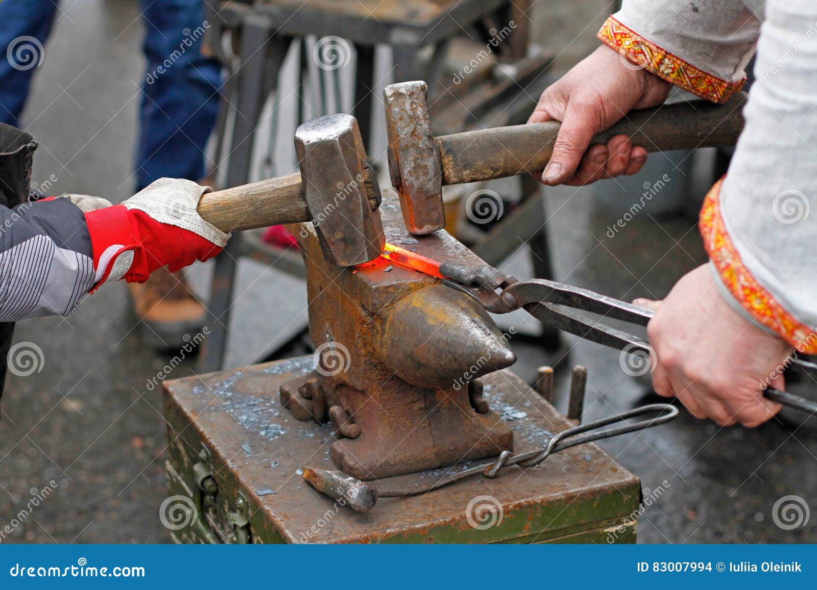 The Hands of a Blacksmith and Learner Forging Hot Iron Stock Photo ...