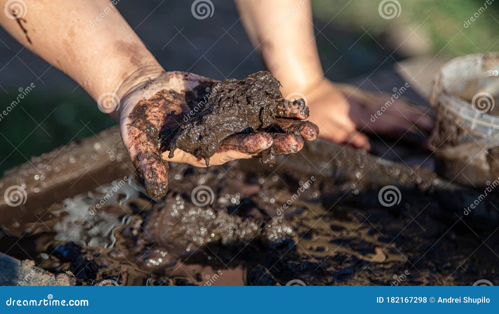 Hands of a Boy in Black Mud on Nature Stock Photo - Image of people ...