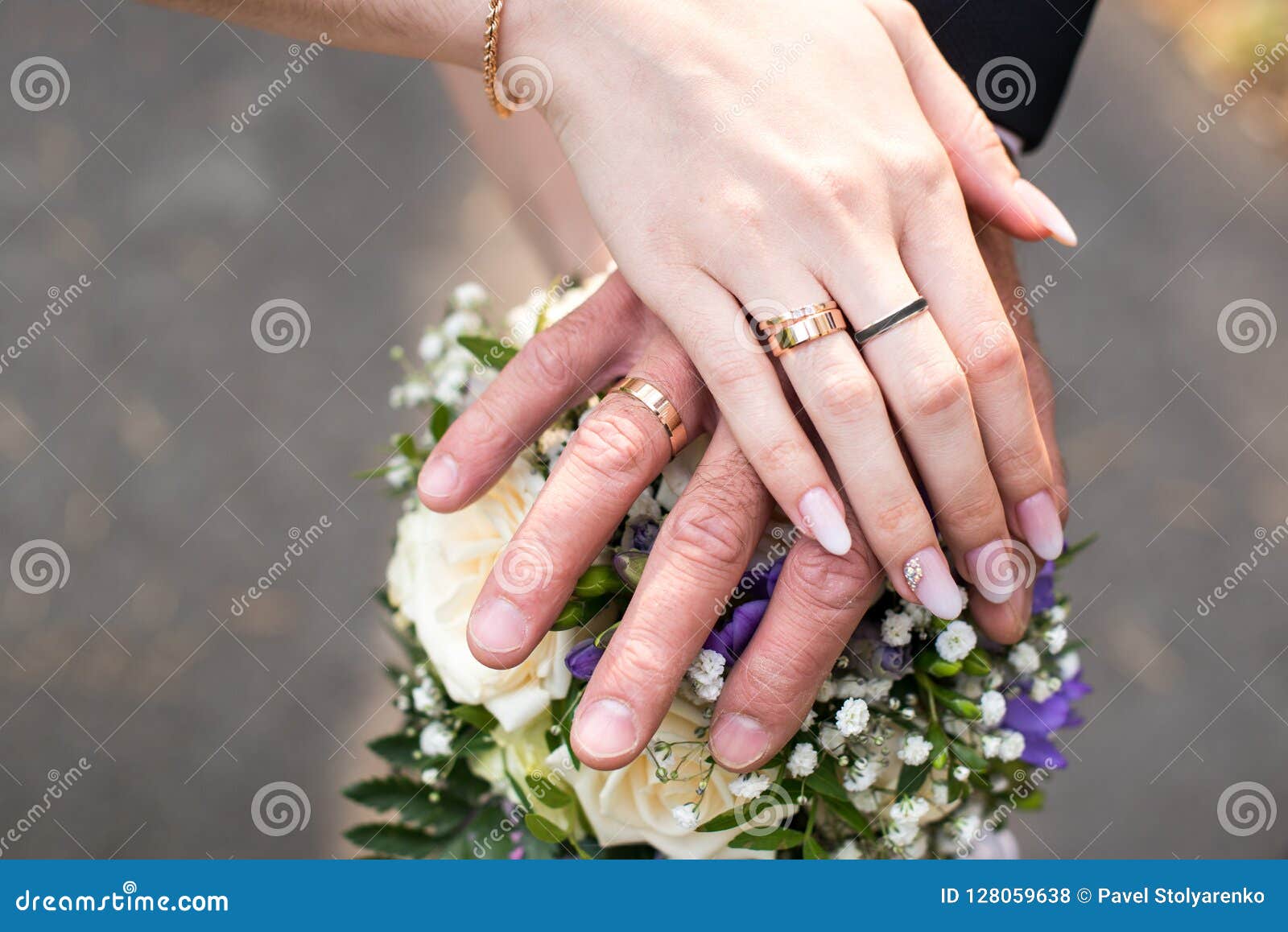 Hands of bride and groom stock photo. Image of female - 128059638