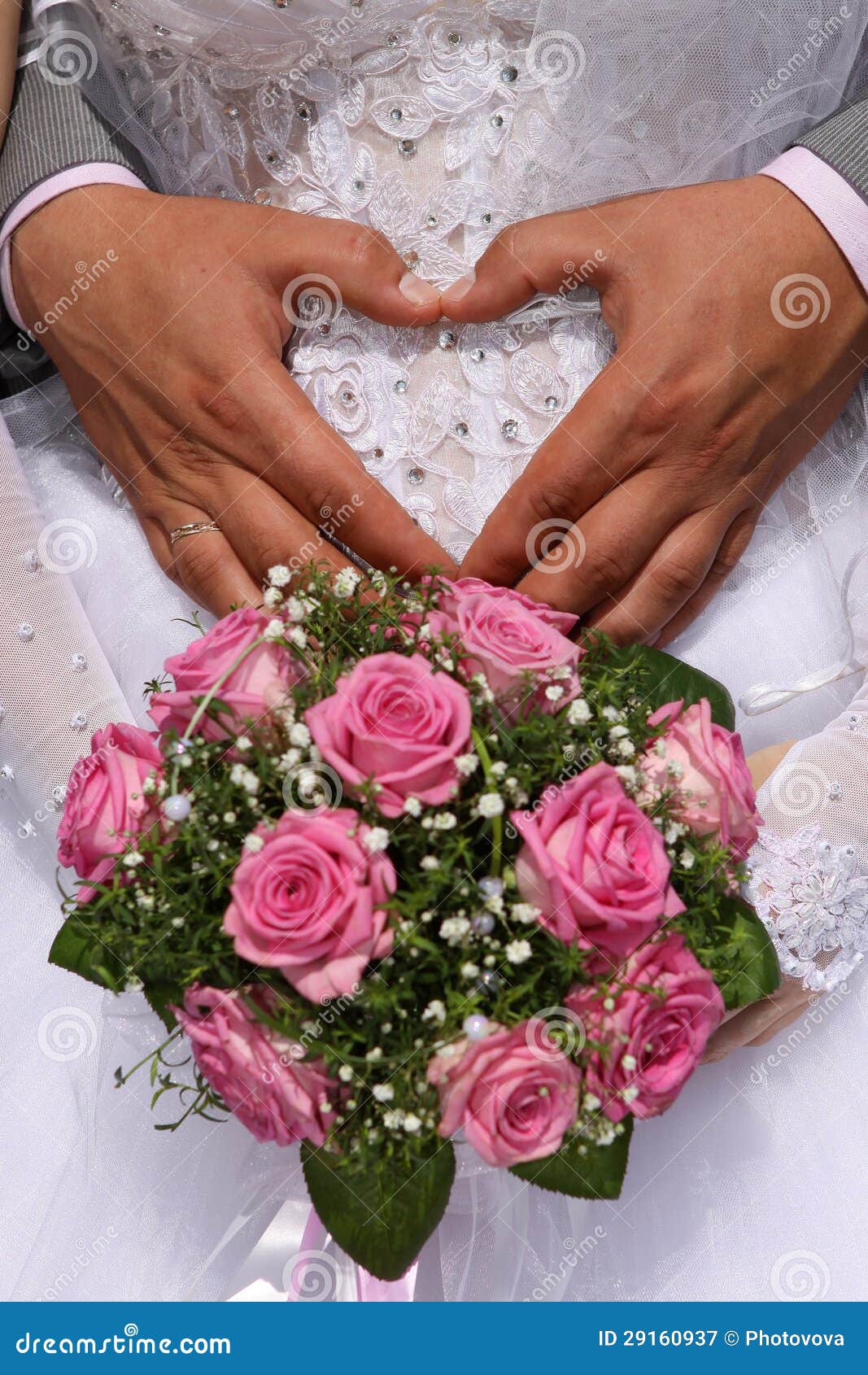 Hands of Bride and Groom in a Heart Shape Stock Image - Image of flower ...
