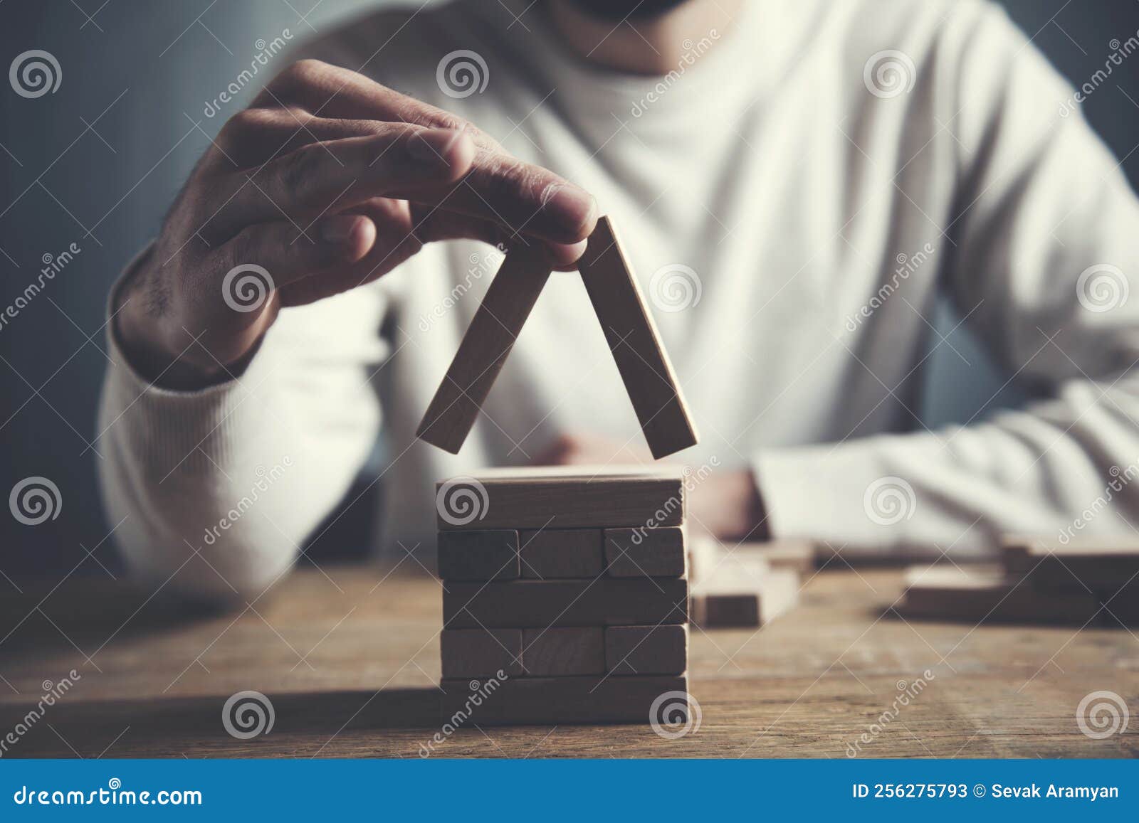 Hands build house of cubes stock image. Image of brick - 256275793