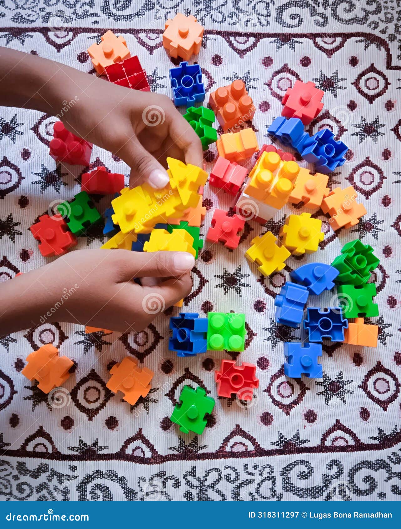 Hands Building with Colorful Toy Blocks on Patterned Rug Stock Image ...