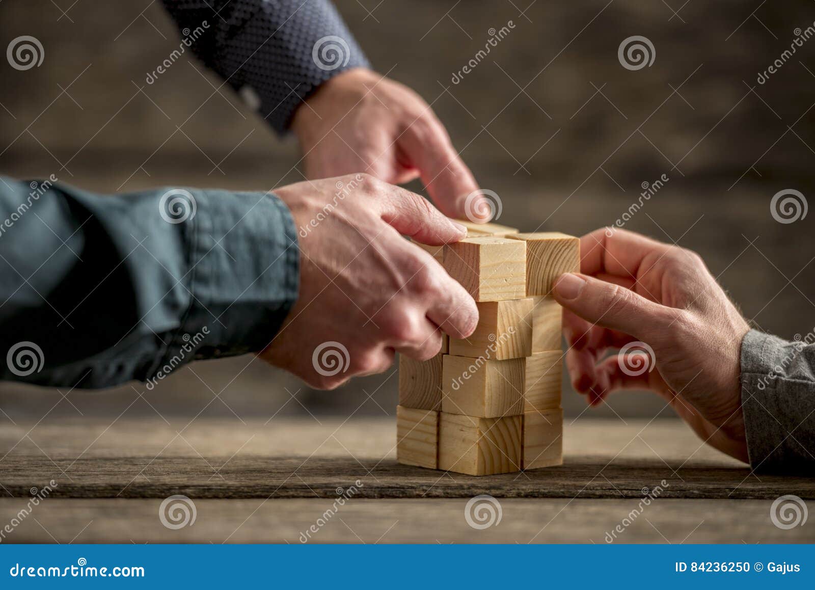 Hands Building a Tower of Wood Blocks Stock Photo - Image of ...
