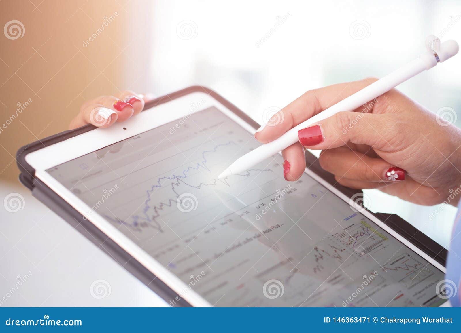Hands of Business Analyzing Financial Statistics Displayed on the ... Hands of Business Analyzing Financial Statistics Displayed on the ...