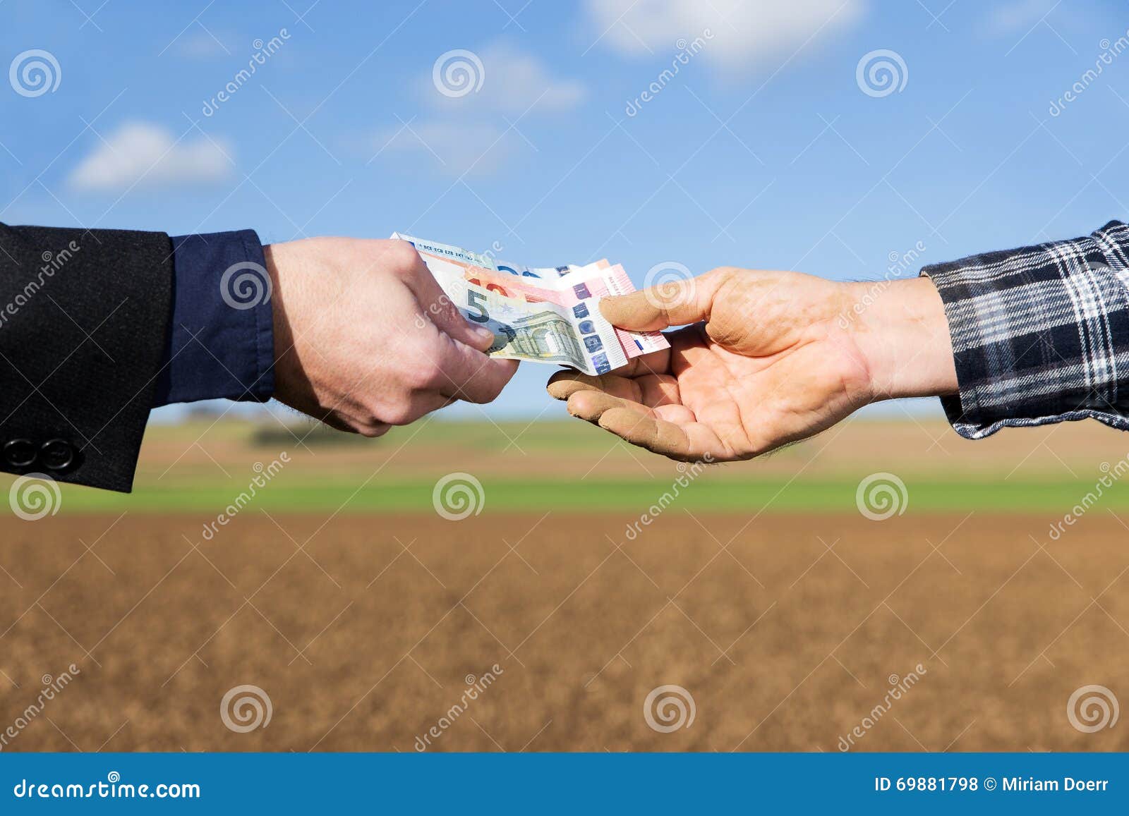 Hands of a Businessman and Farmer with a Money Transfer Stock Photo ...