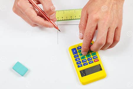 Hands Calculate Using a Pocket Calculator Over Workplace of the ...