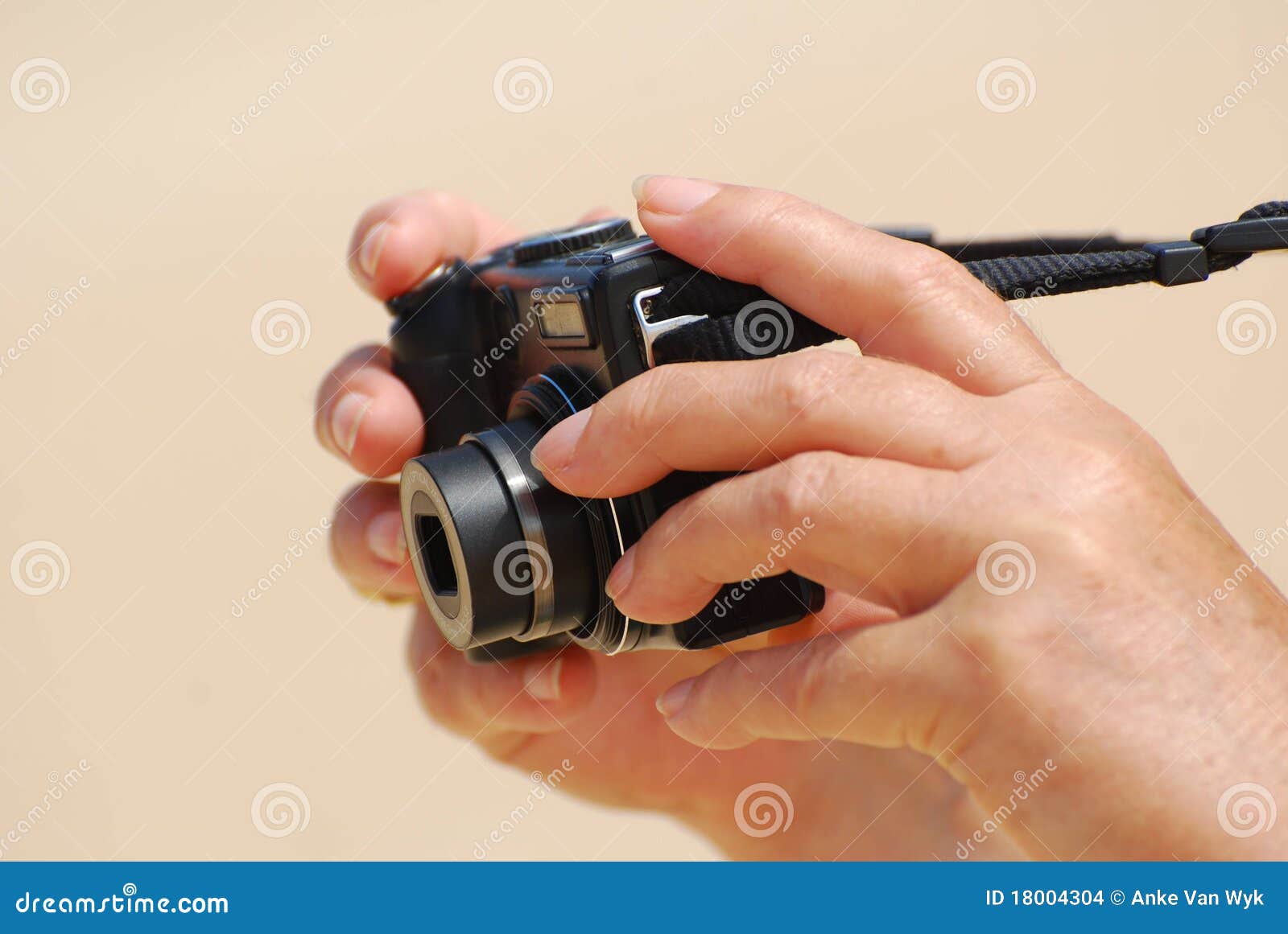 Hands with camera in focus stock photo. Image of photographing - 18004304