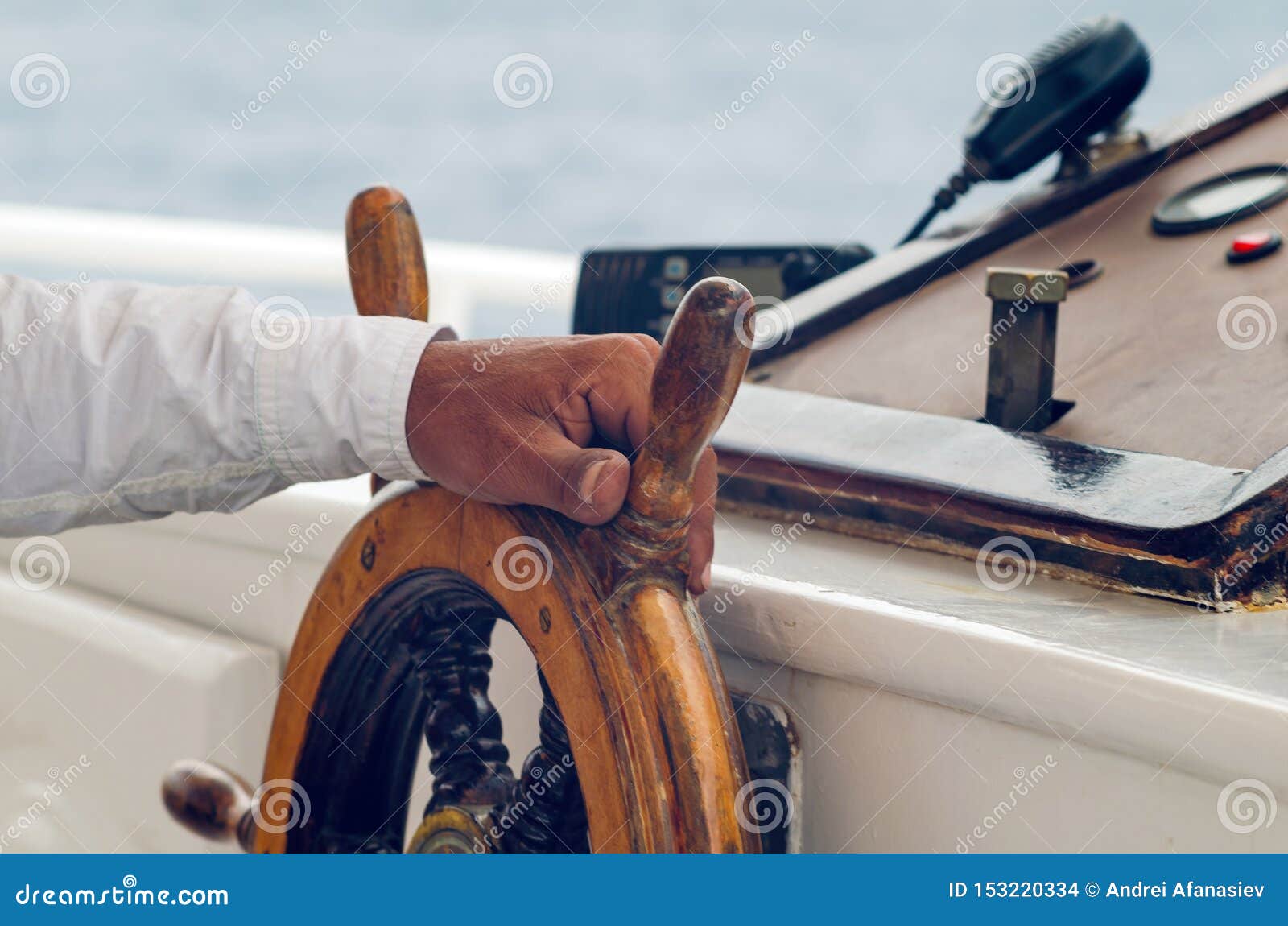 Hands of the Captain Holding the Wheel on the Deck of the Ship Stock ...