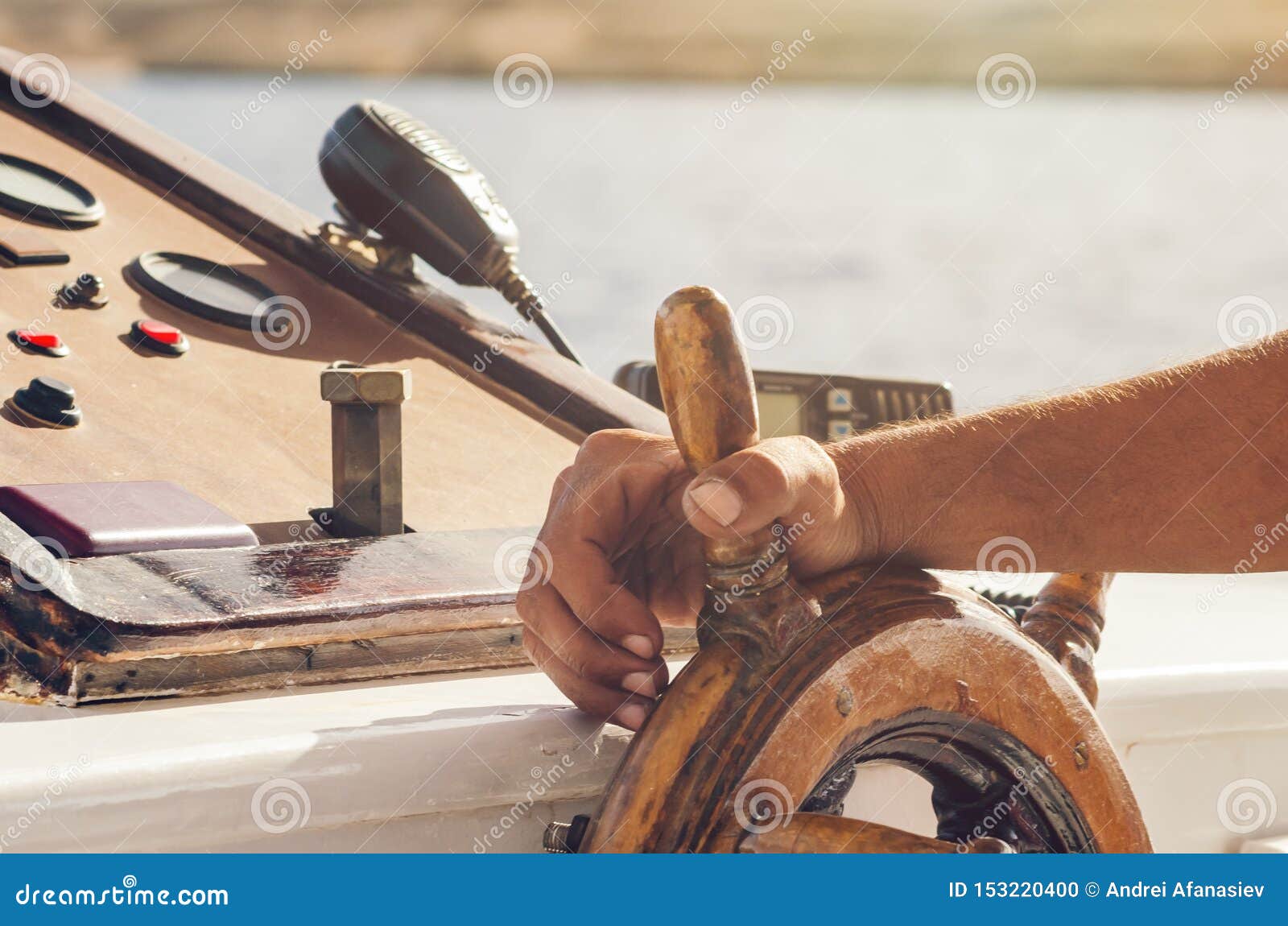Hands of the Captain Holding the Wheel on the Deck of the Ship Stock ...