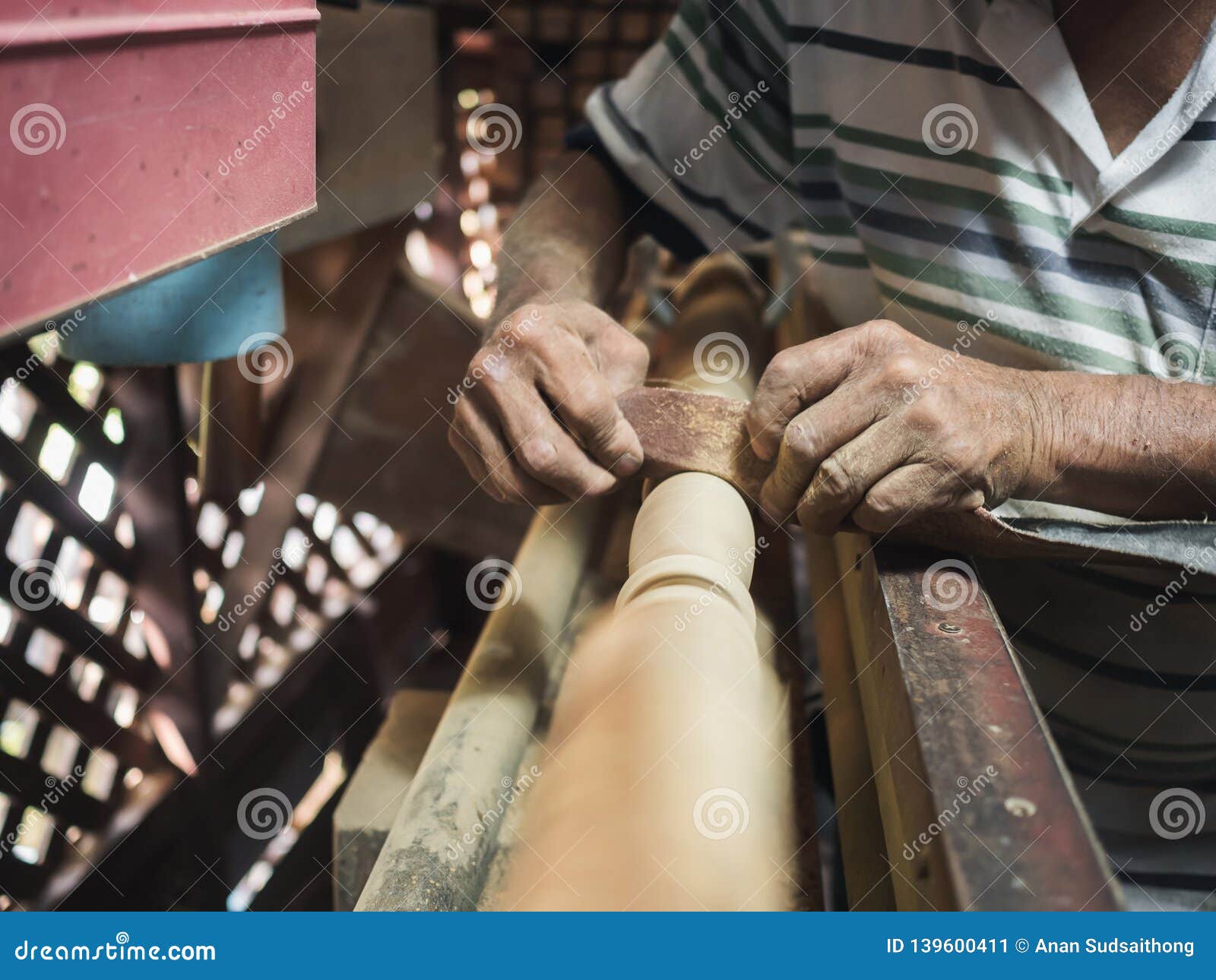Hands of Carpenter Turning Wood on Lathe Machine in Carpentry Workshop ...