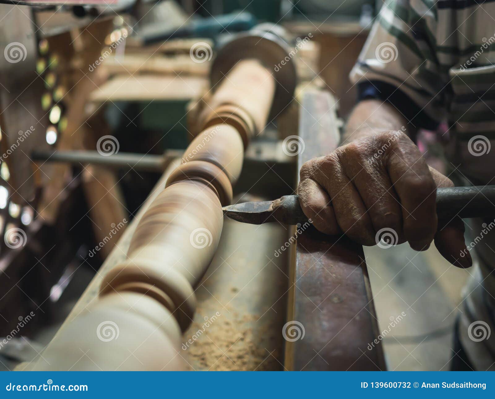 Hands of Carpenter Turning Wood on Lathe Machine in Carpentry Workshop ...