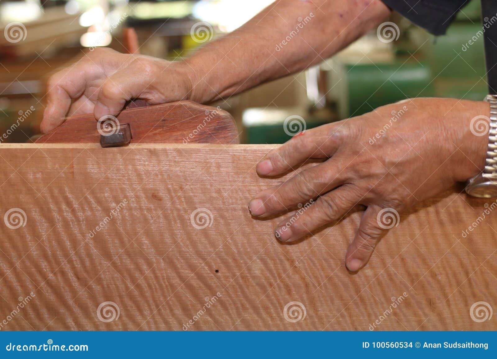 Hands of Carpenter Working on a Piece of Wood in Carpentry Workshop ...