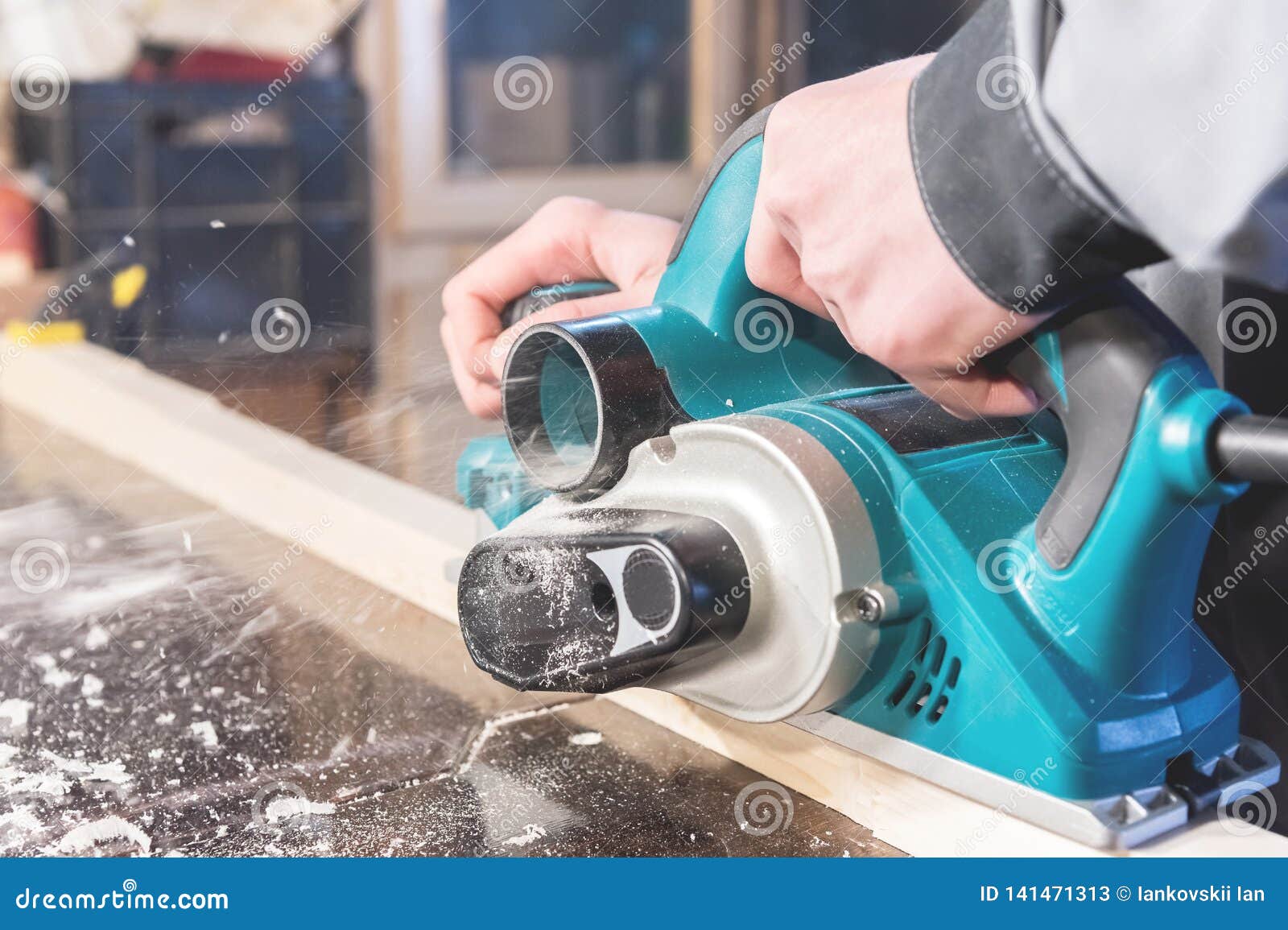 The Hands of a Carpenter Working Woodworking Power Tools. Close Up of ...