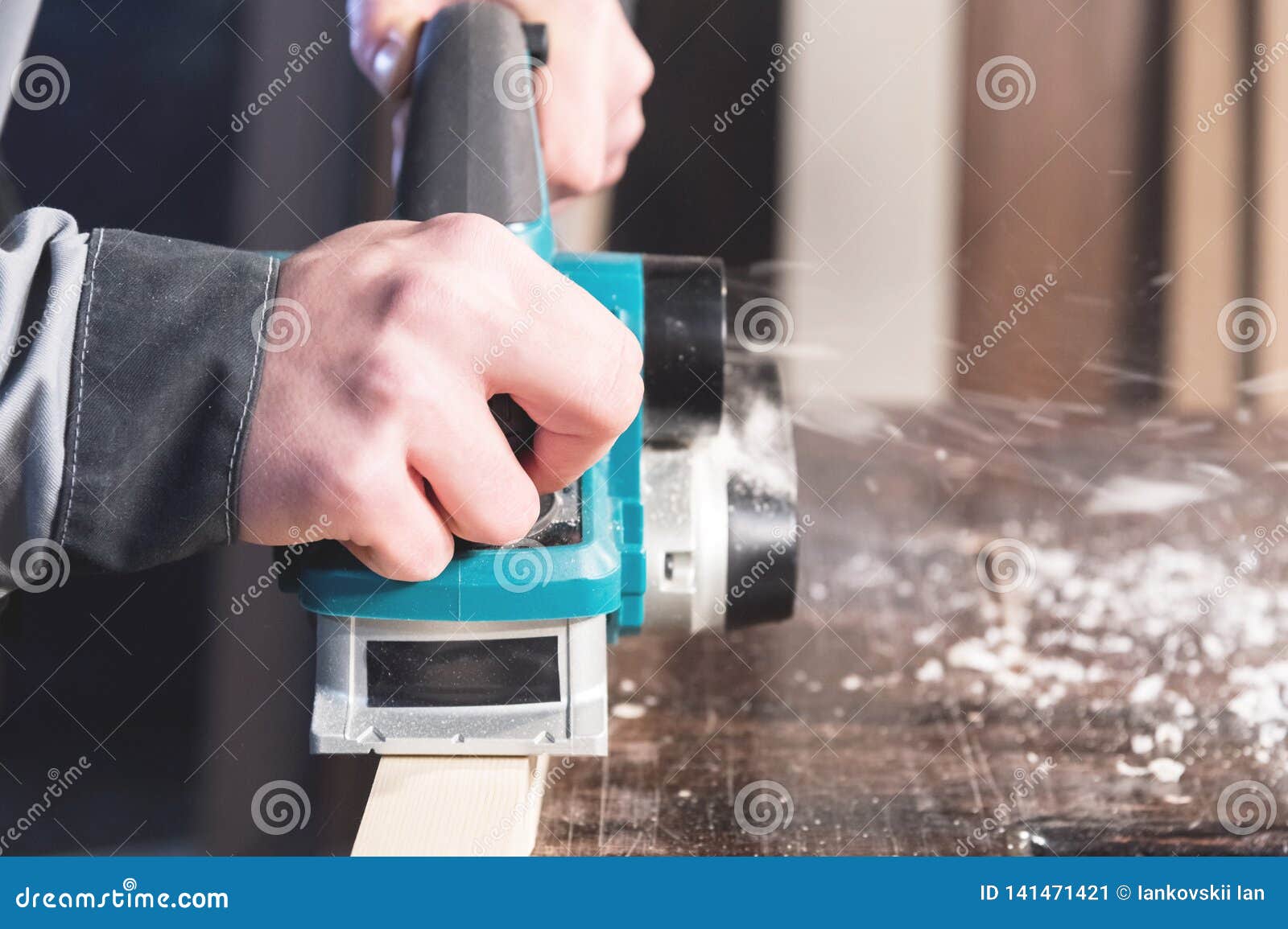 The Hands of a Carpenter Working Woodworking Power Tools. Close Up of ...